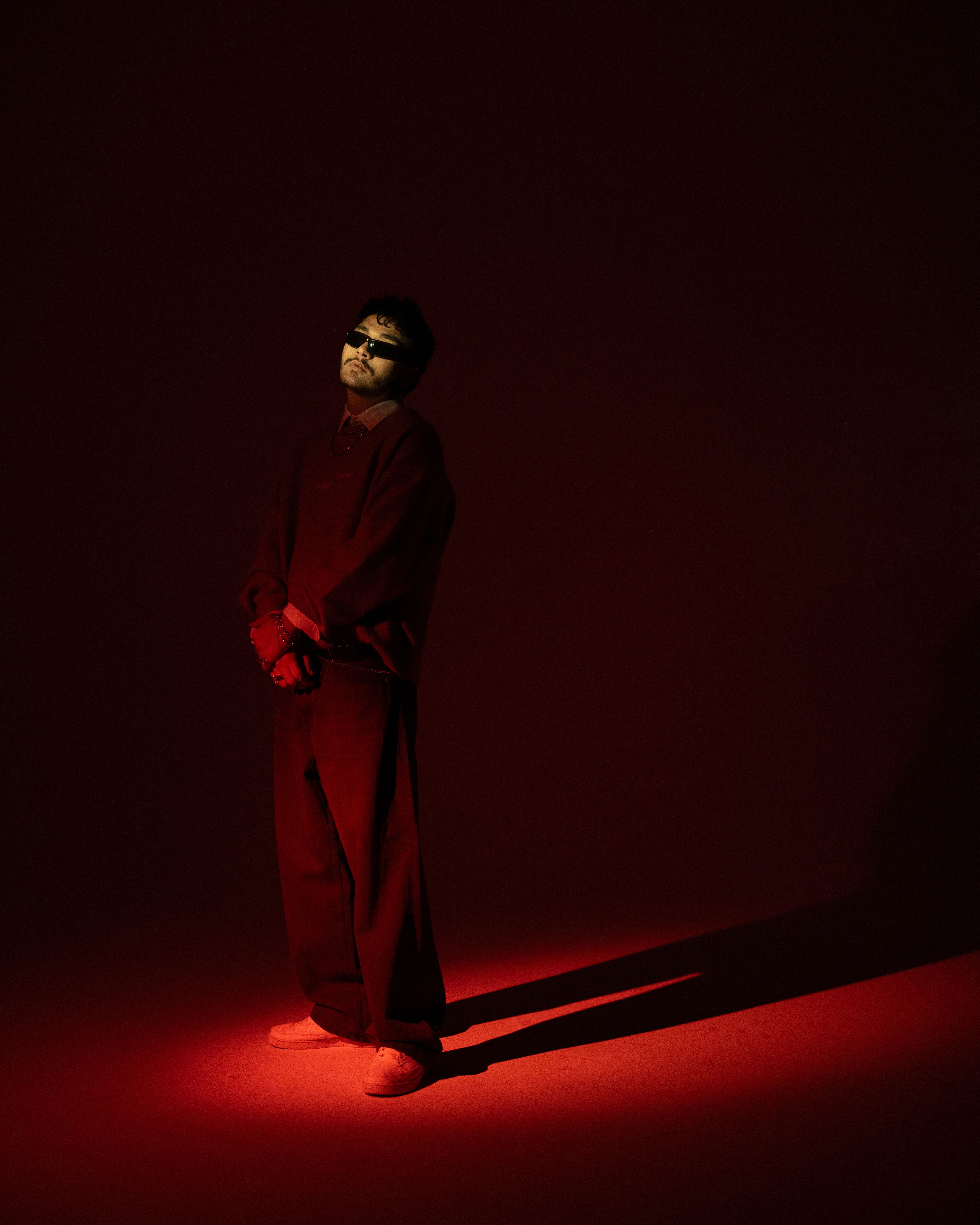 Man in Red Light with Dramatic Shadow · Free Stock Photo