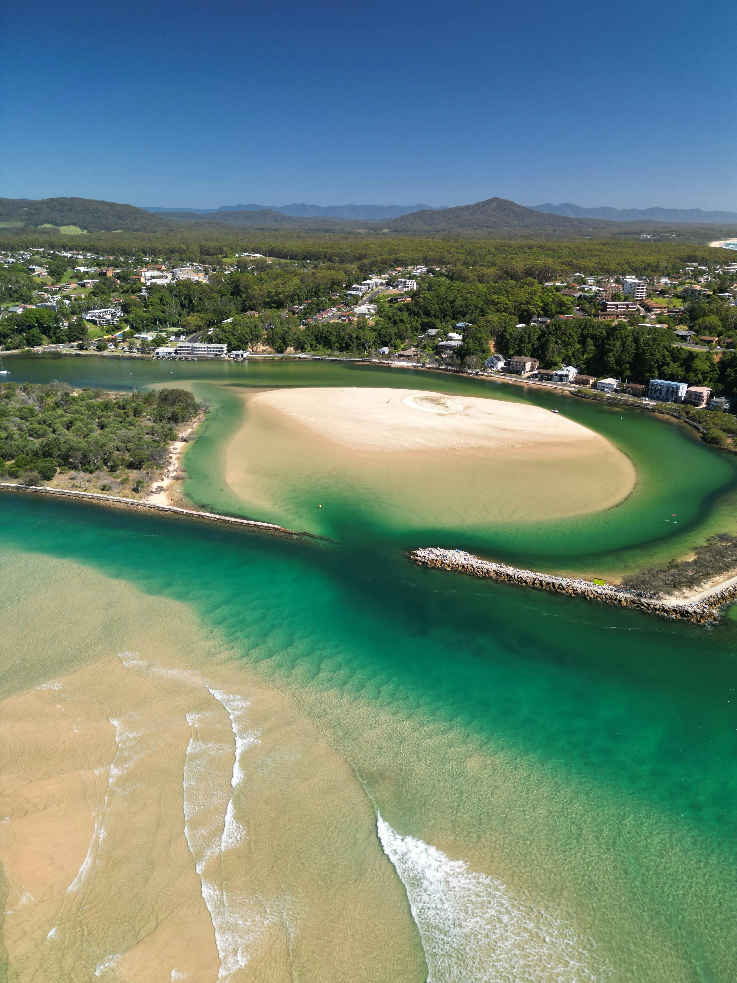 Scenic Aerial View of Coastal Inlet and Beach · Free Stock Photo