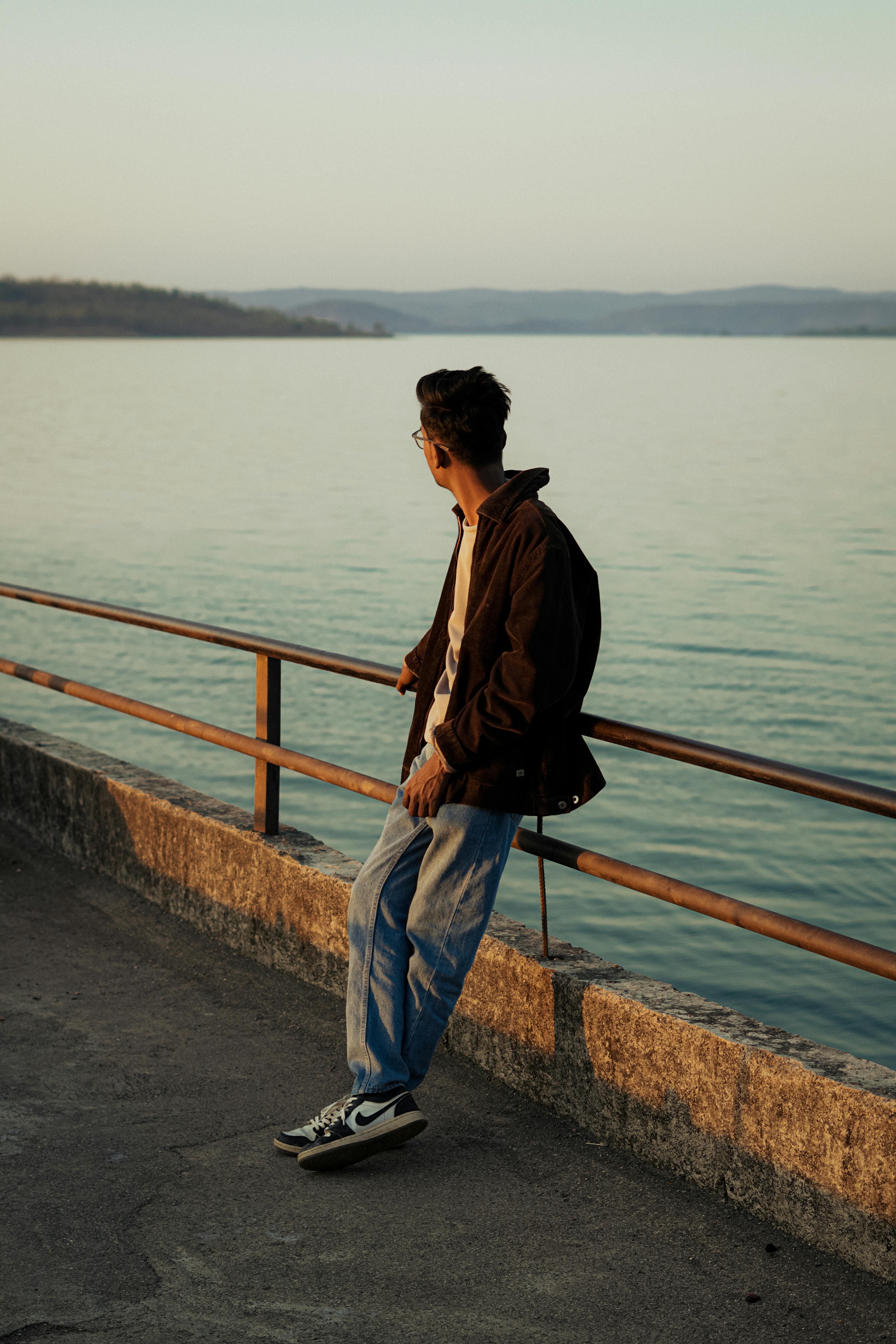 Young Man Gazing at Lake in Thuti, India · Free Stock Photo