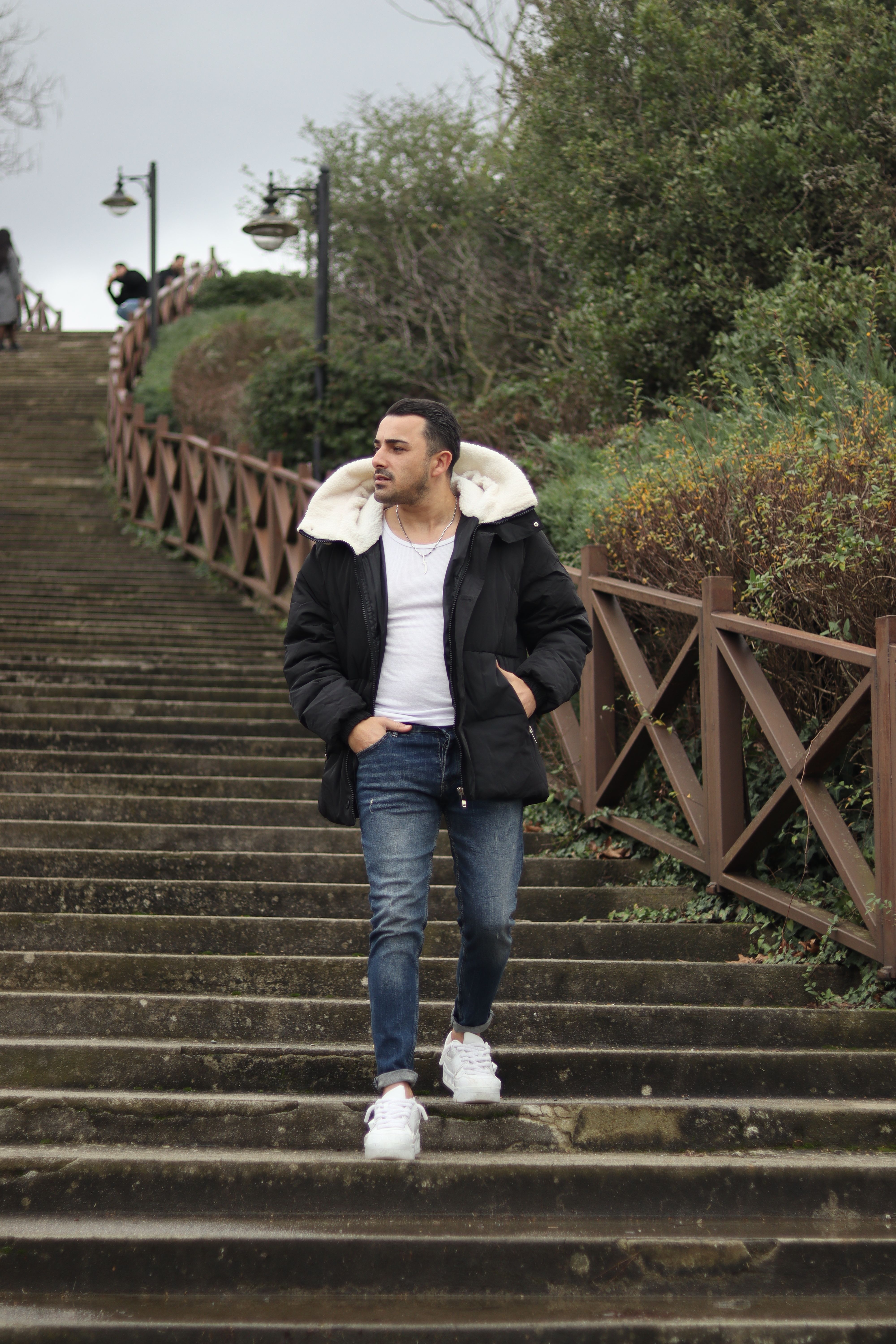 Stylish Man Walking Down Stone Steps Outdoors · Free Stock Photo