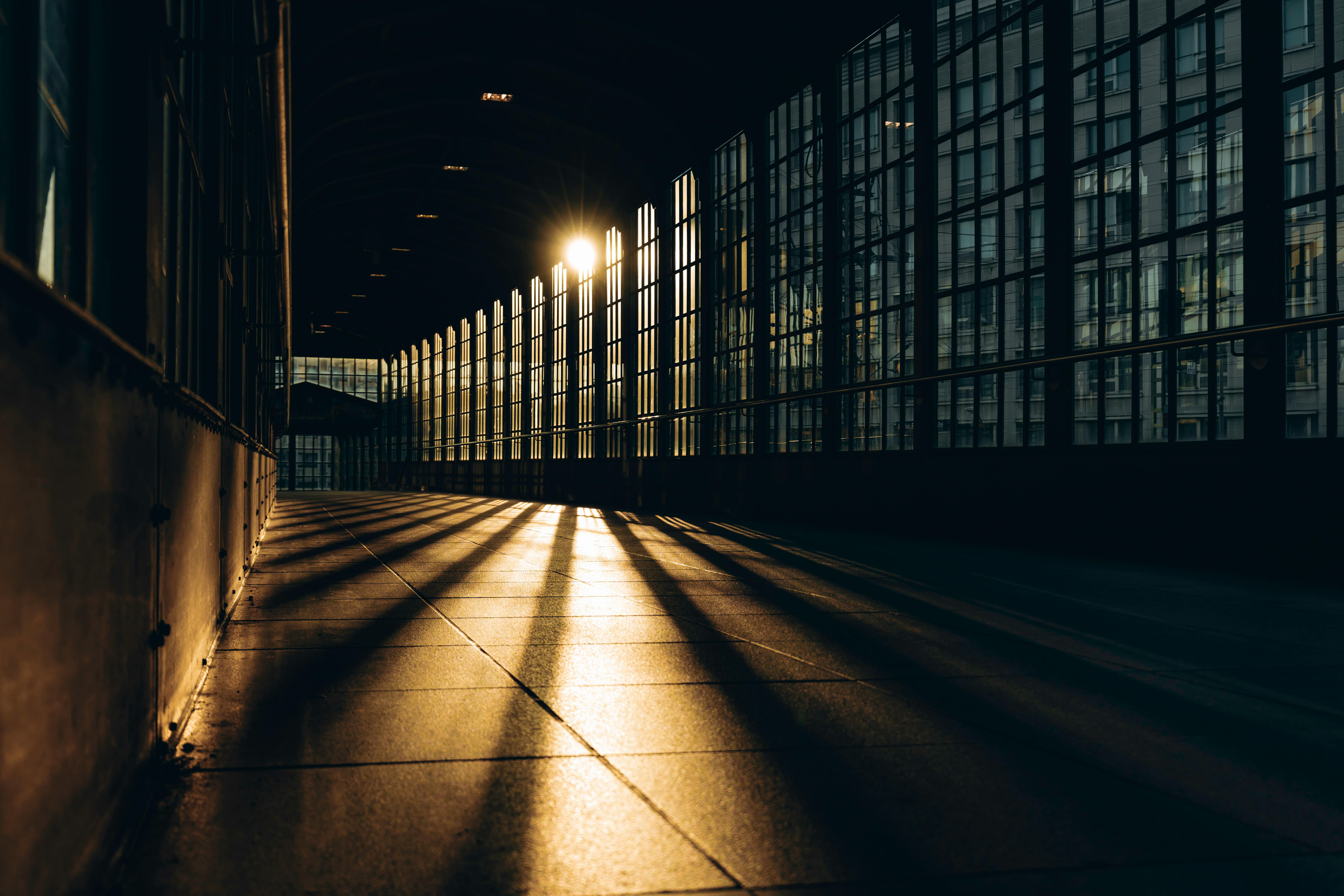 Sunlit Urban Corridor with Dramatic Shadows · Free Stock Photo