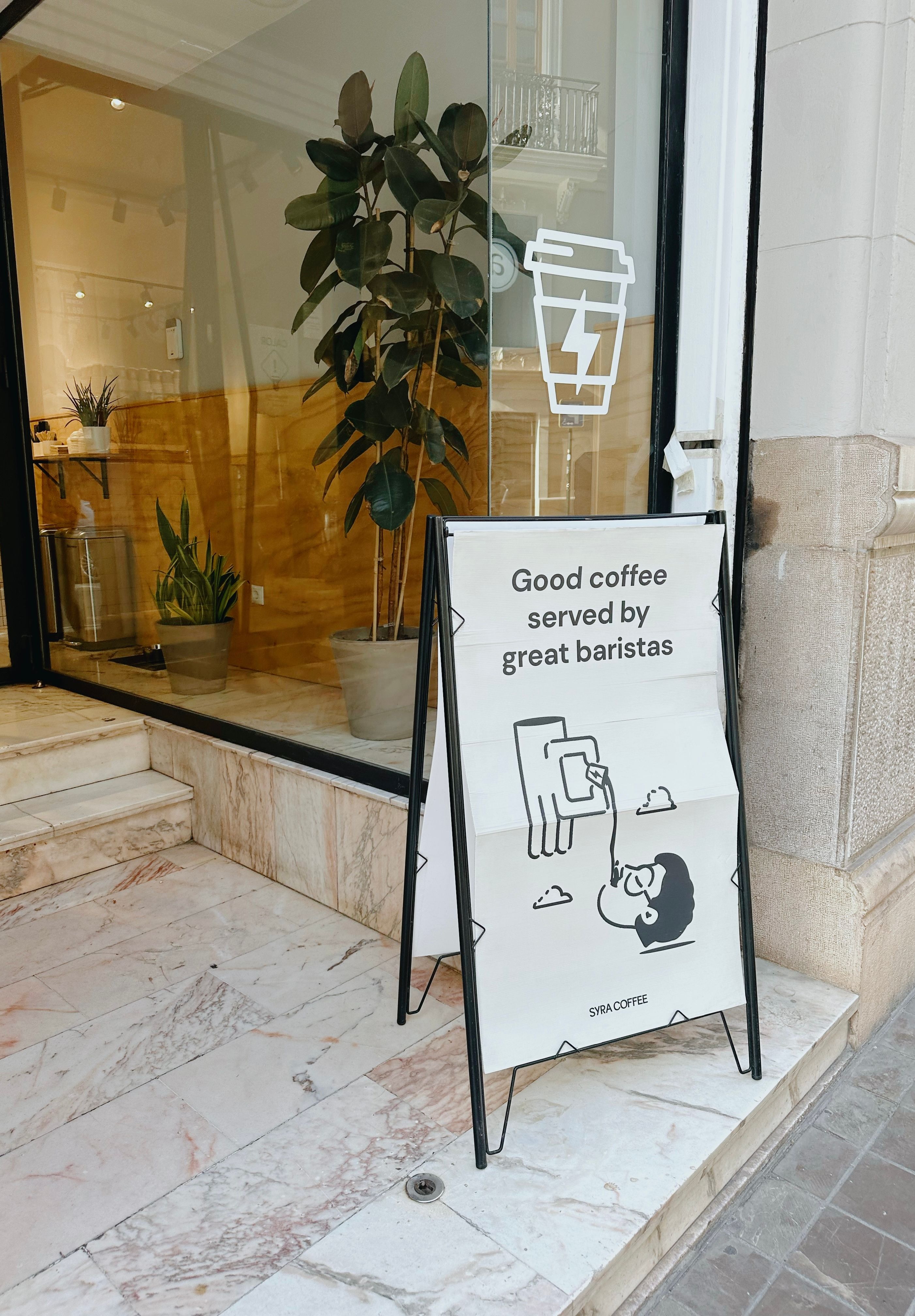 Cafe Entrance with Sign and Plant · Free Stock Photo