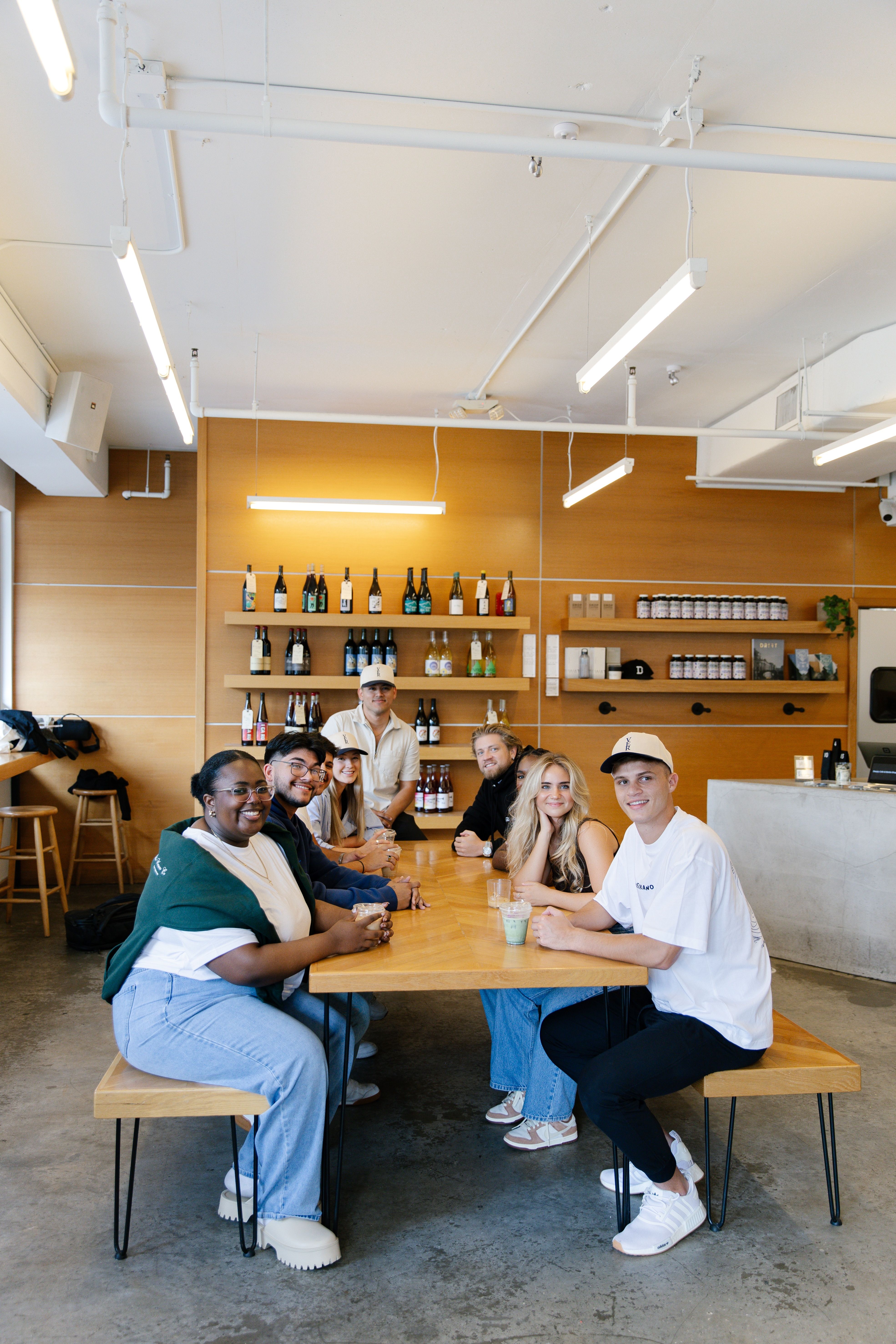 Group enjoying casual gathering in modern cafe · Free Stock Photo