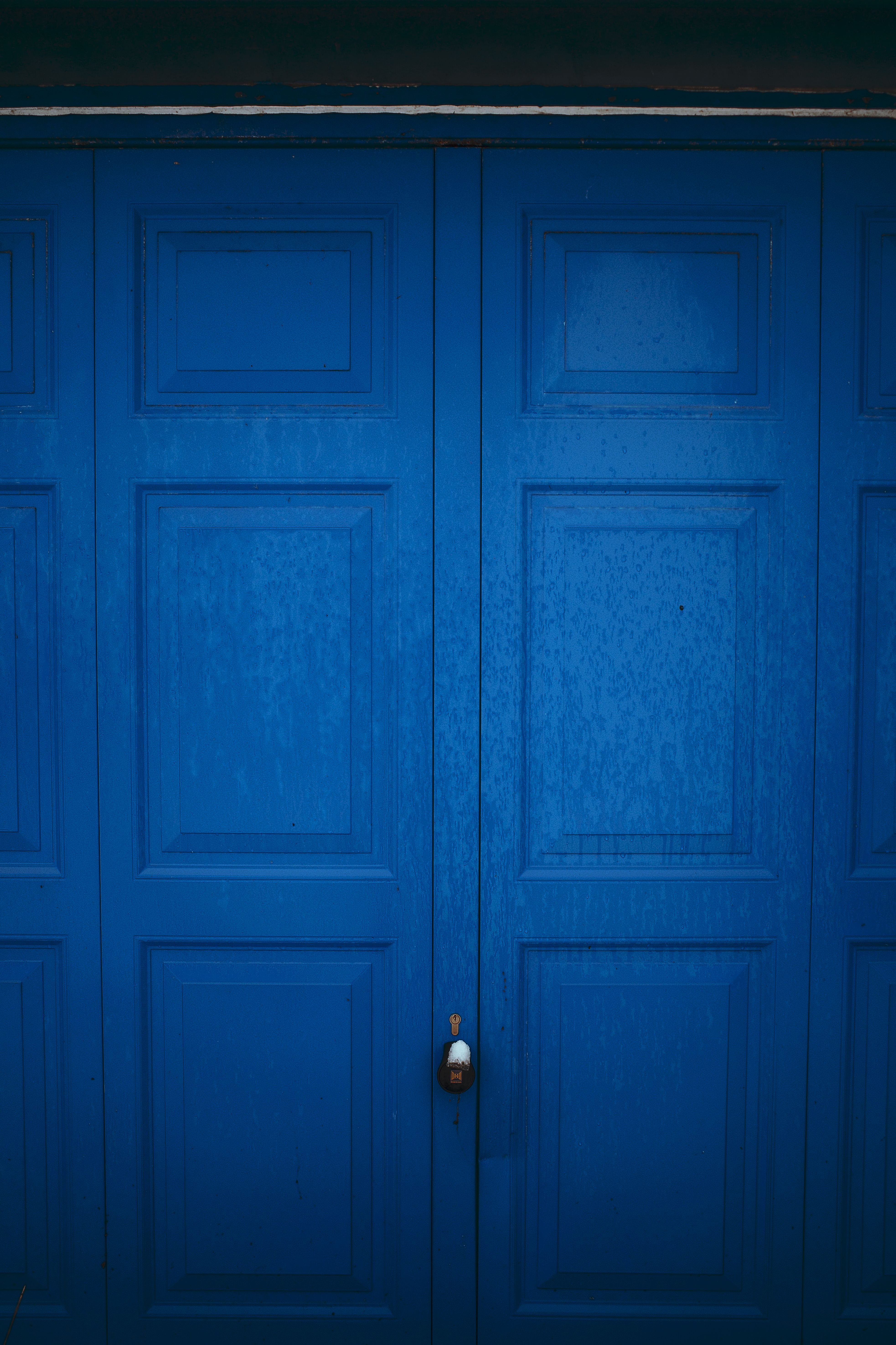 Vibrant Blue Wooden Door with Textured Surface · Free Stock Photo