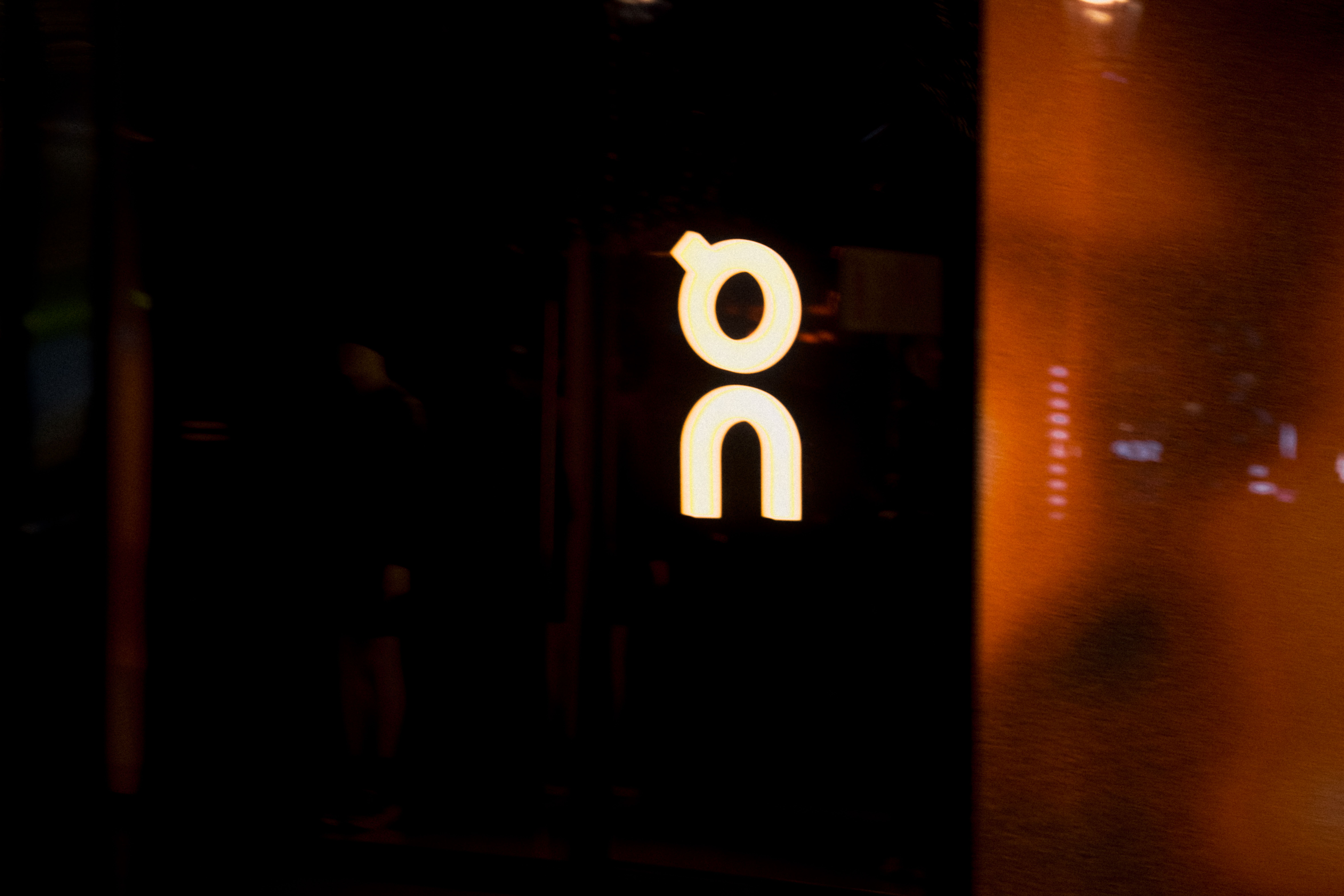Minimalist Neon Sign With Reflective Glow · Free Stock Photo