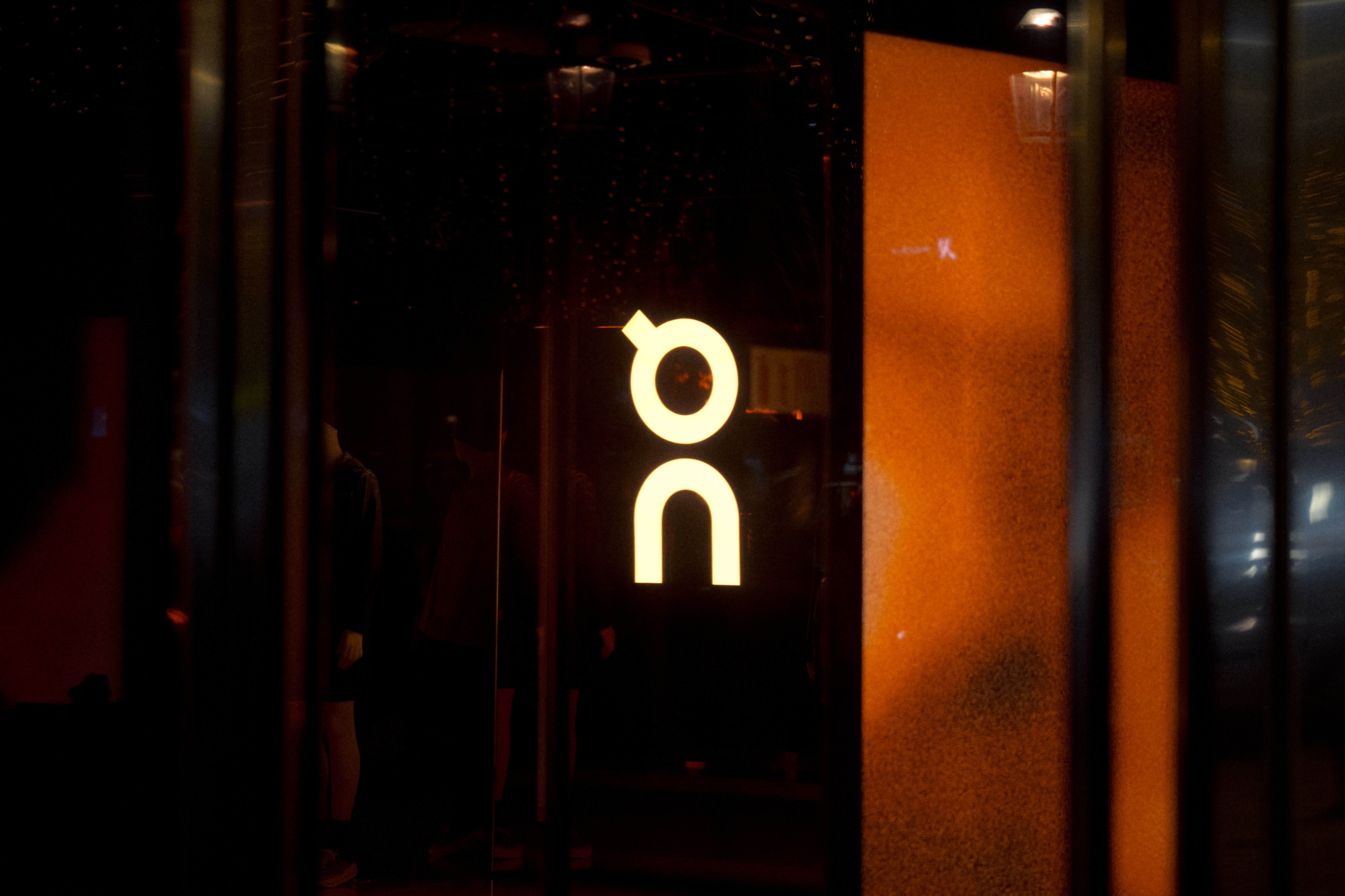 Illuminated Storefront Sign at Night · Free Stock Photo
