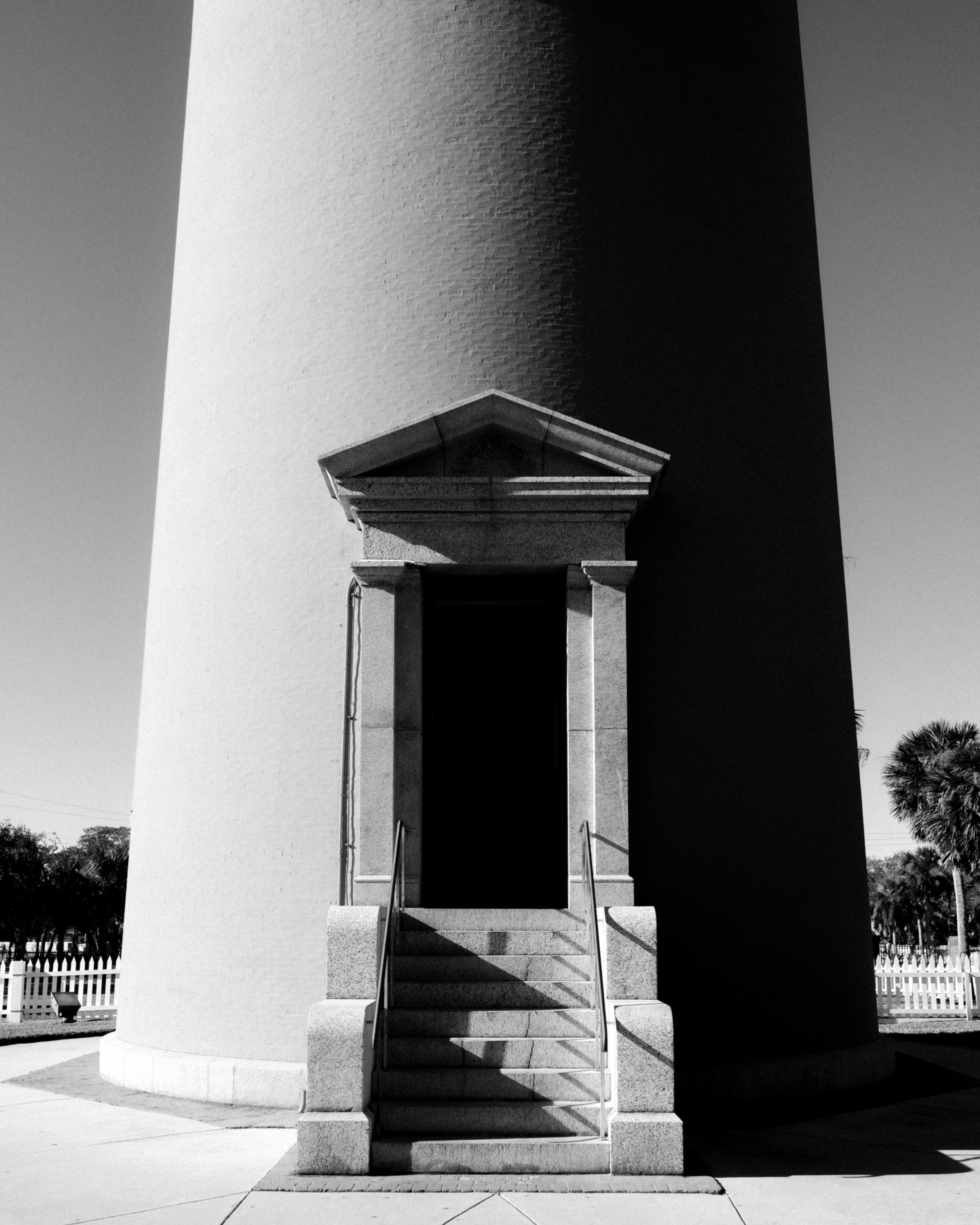 Black and White Lighthouse Entrance Perspective · Free Stock Photo