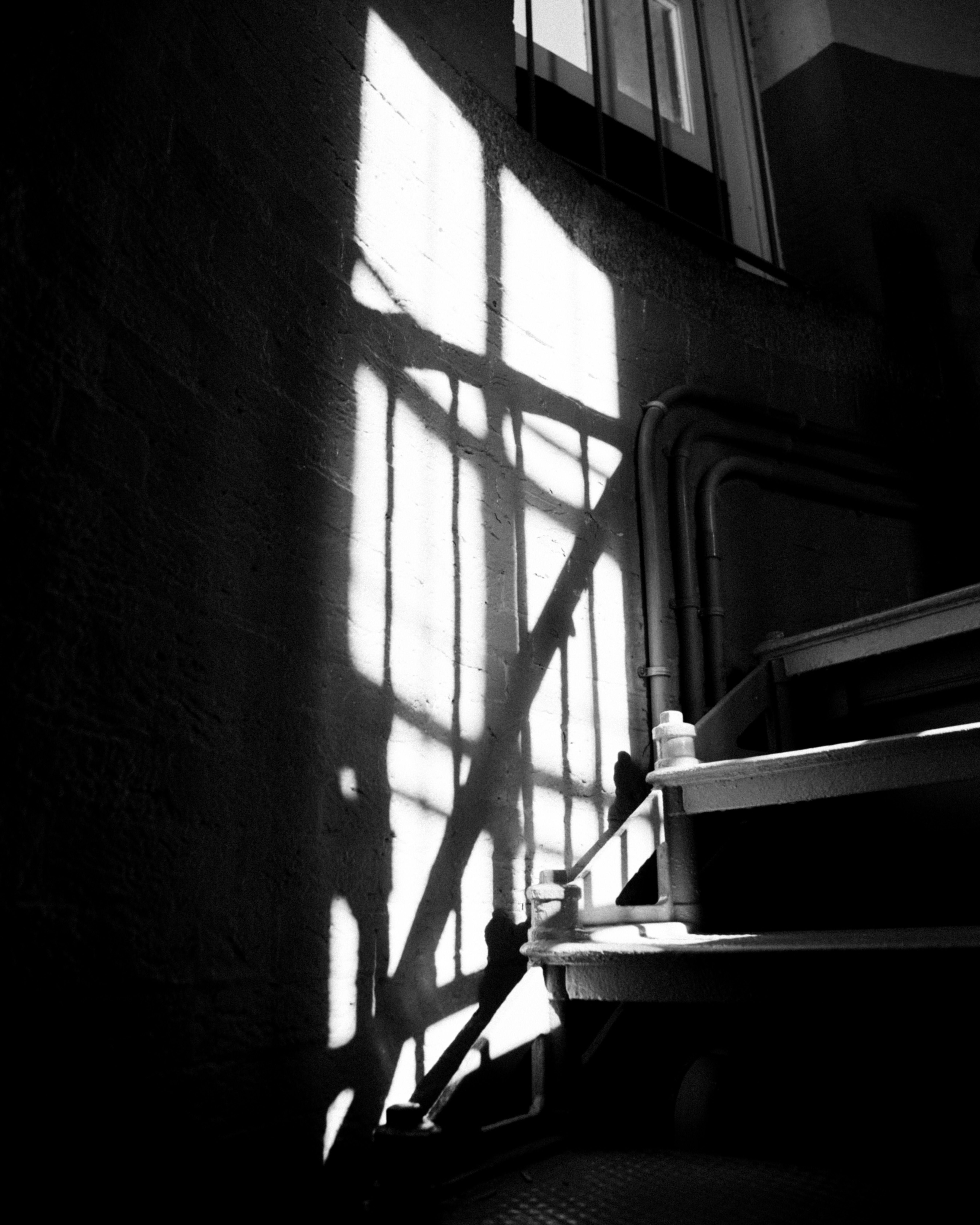 Moody Staircase with Dramatic Shadow Play · Free Stock Photo
