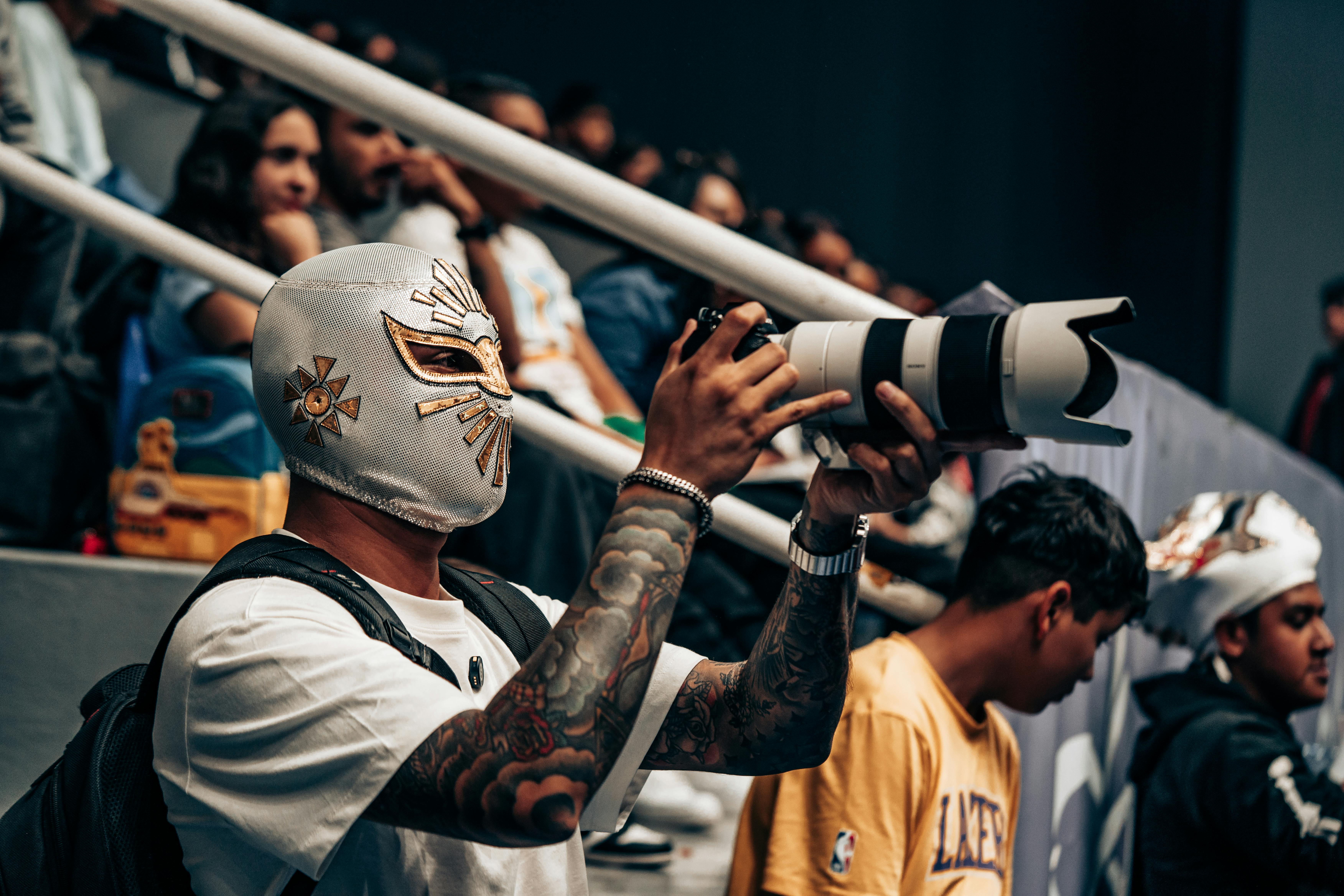 Masked Photographer Capturing Event in Queretaro · Free Stock Photo