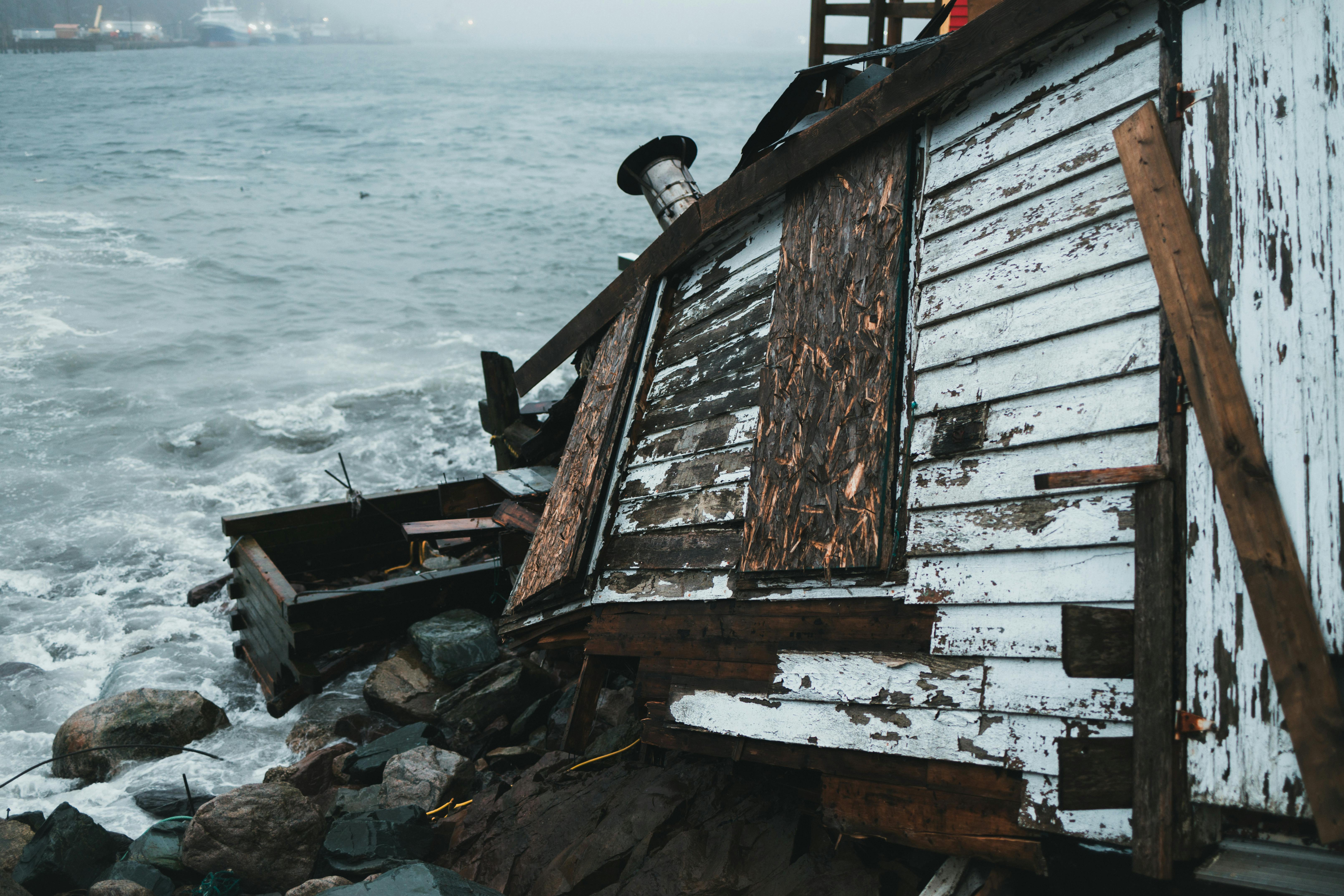 Weathered Coastal Structure Against Stormy Sea · Free Stock Photo
