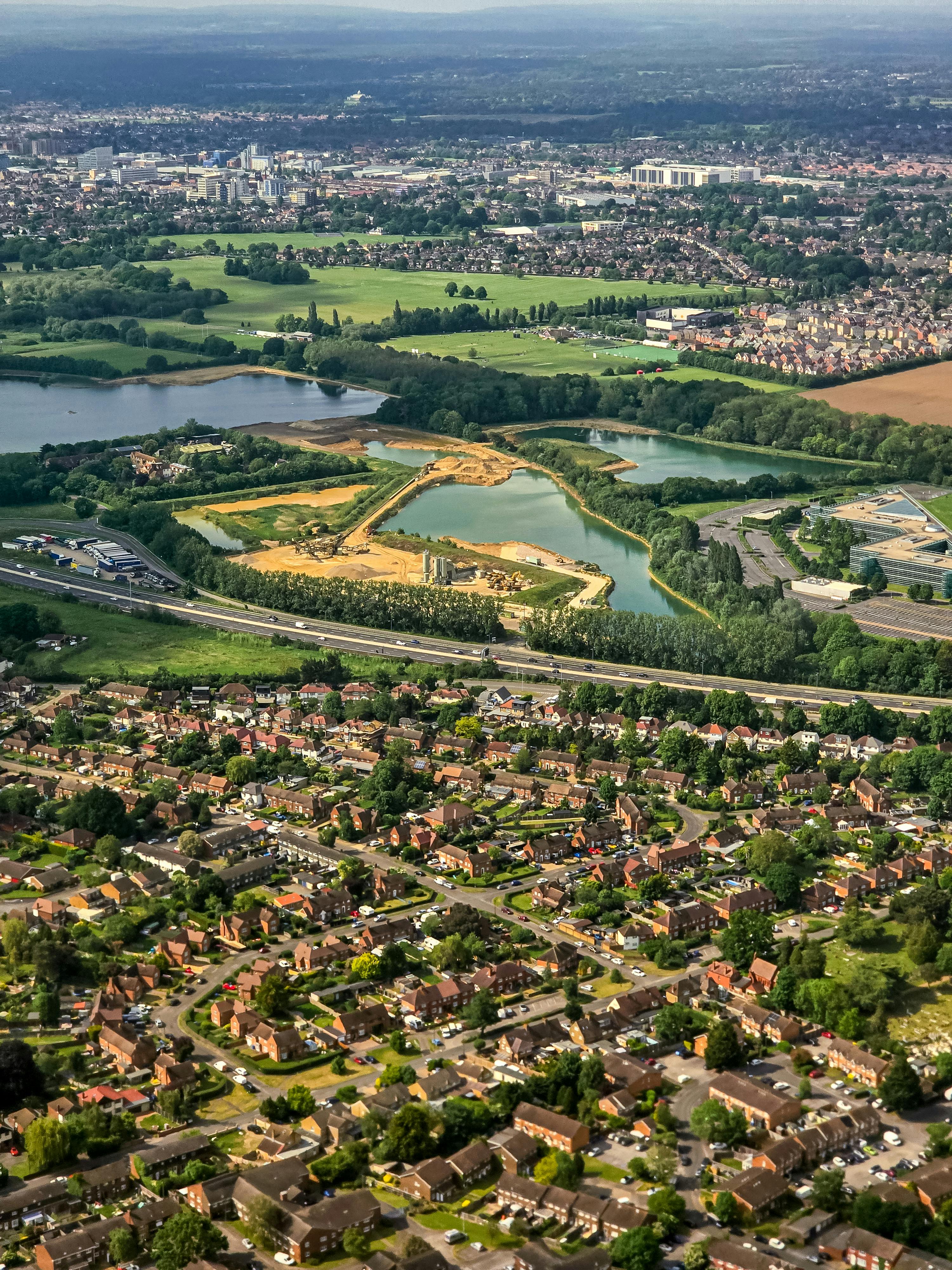 Aerial View of Suburban Neighborhood and Farmlands · Free Stock Photo