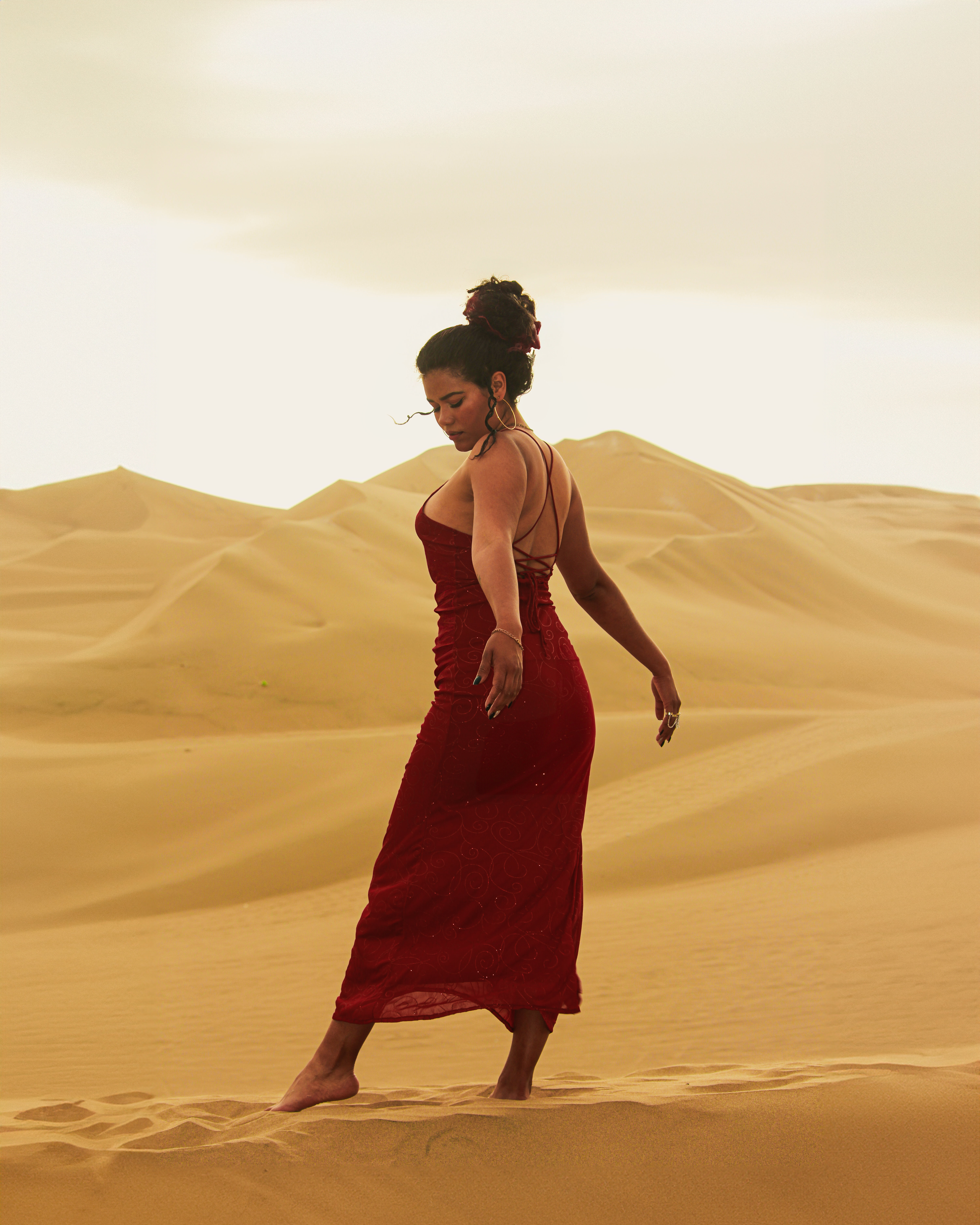 Elegant Woman in Red Dress Walking Through Desert · Free Stock Photo