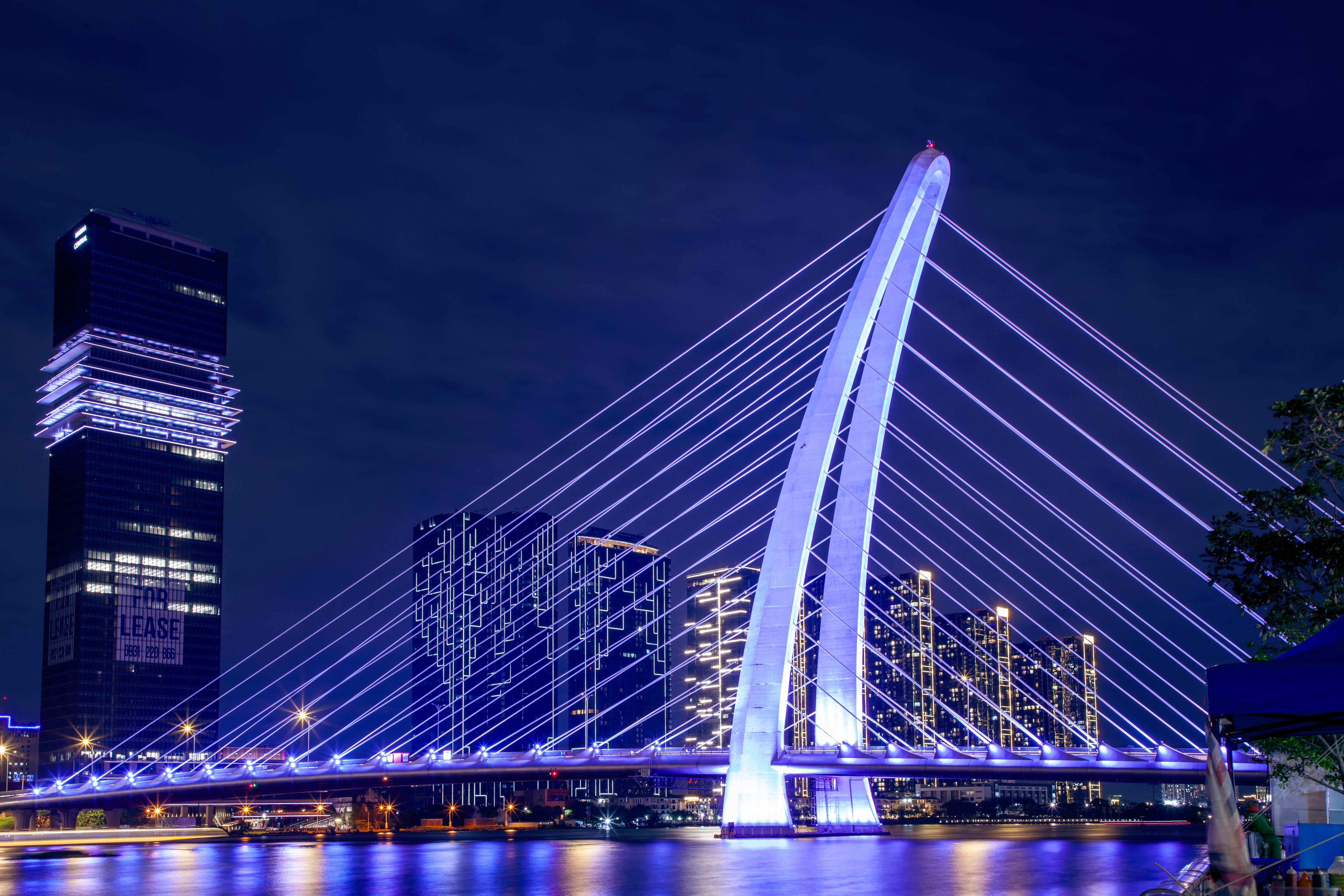 Illuminated Modern Cable-Stayed Bridge at Night · Free Stock Photo