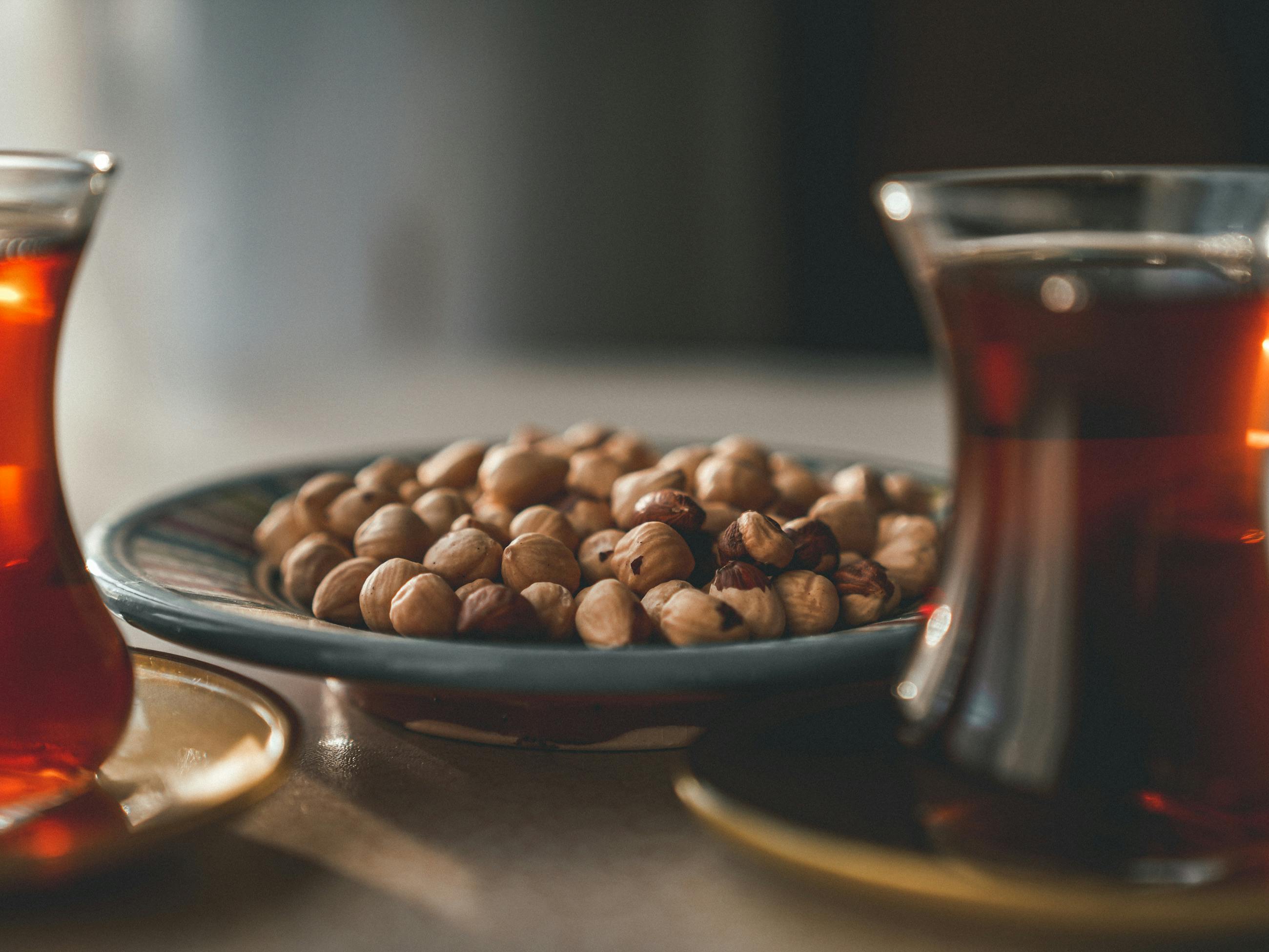 Turkish Tea and Hazelnuts on a Table · Free Stock Photo