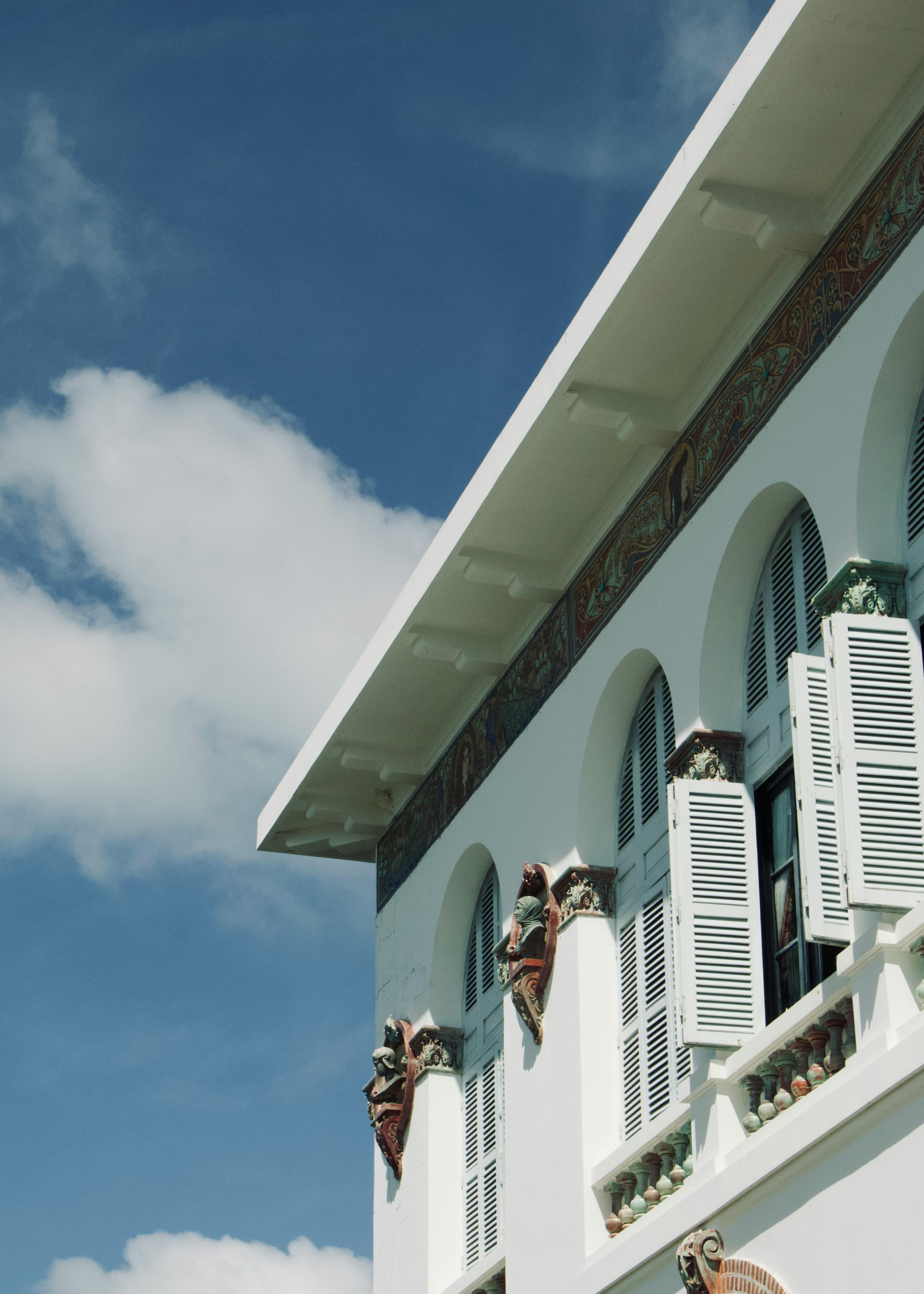 Historic White Building with Architectural Details · Free Stock Photo
