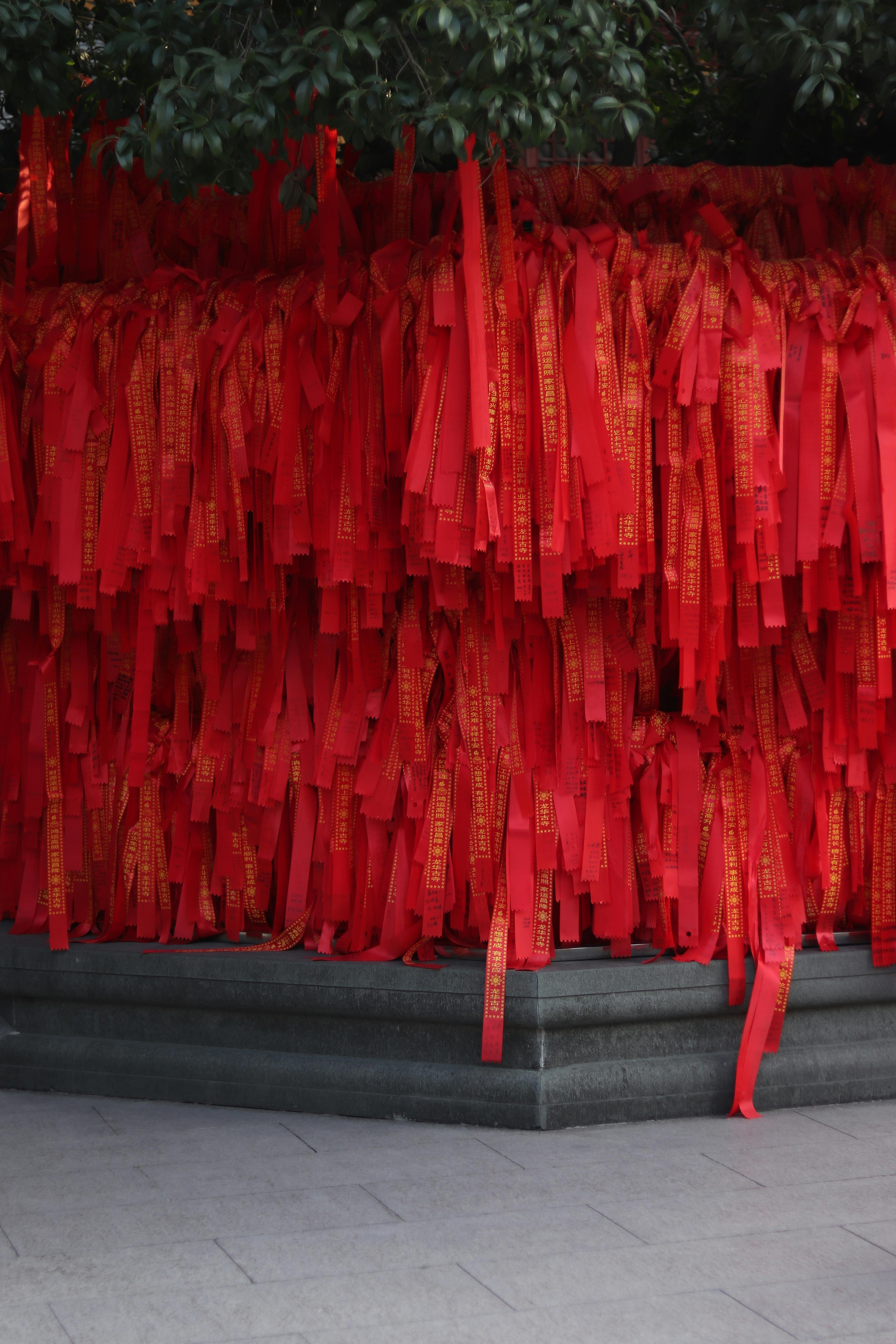 Vibrant Red Fortune Ribbons in Temple Courtyard · Free Stock Photo