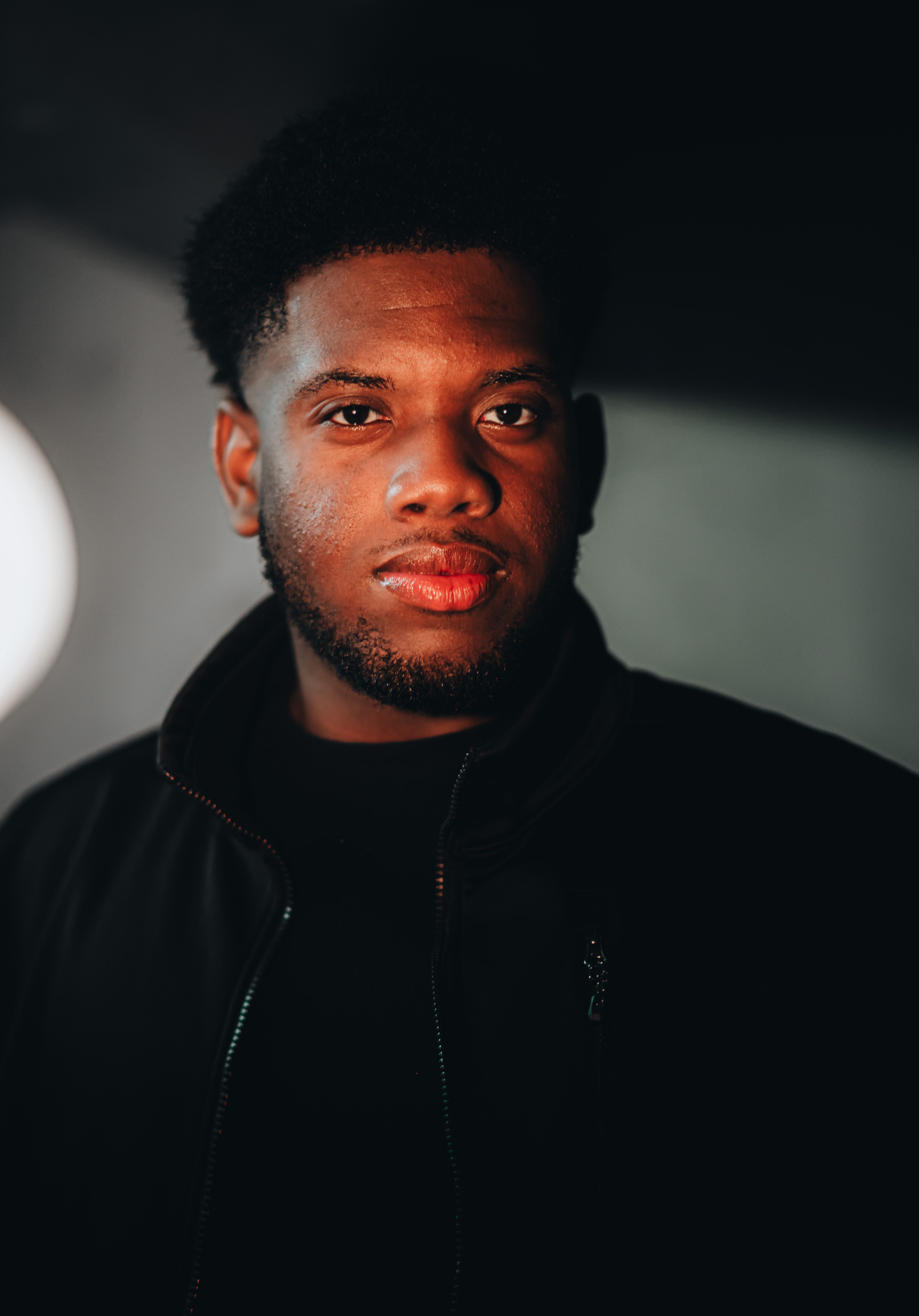 Portrait of Young Man in Dramatic Lighting · Free Stock Photo
