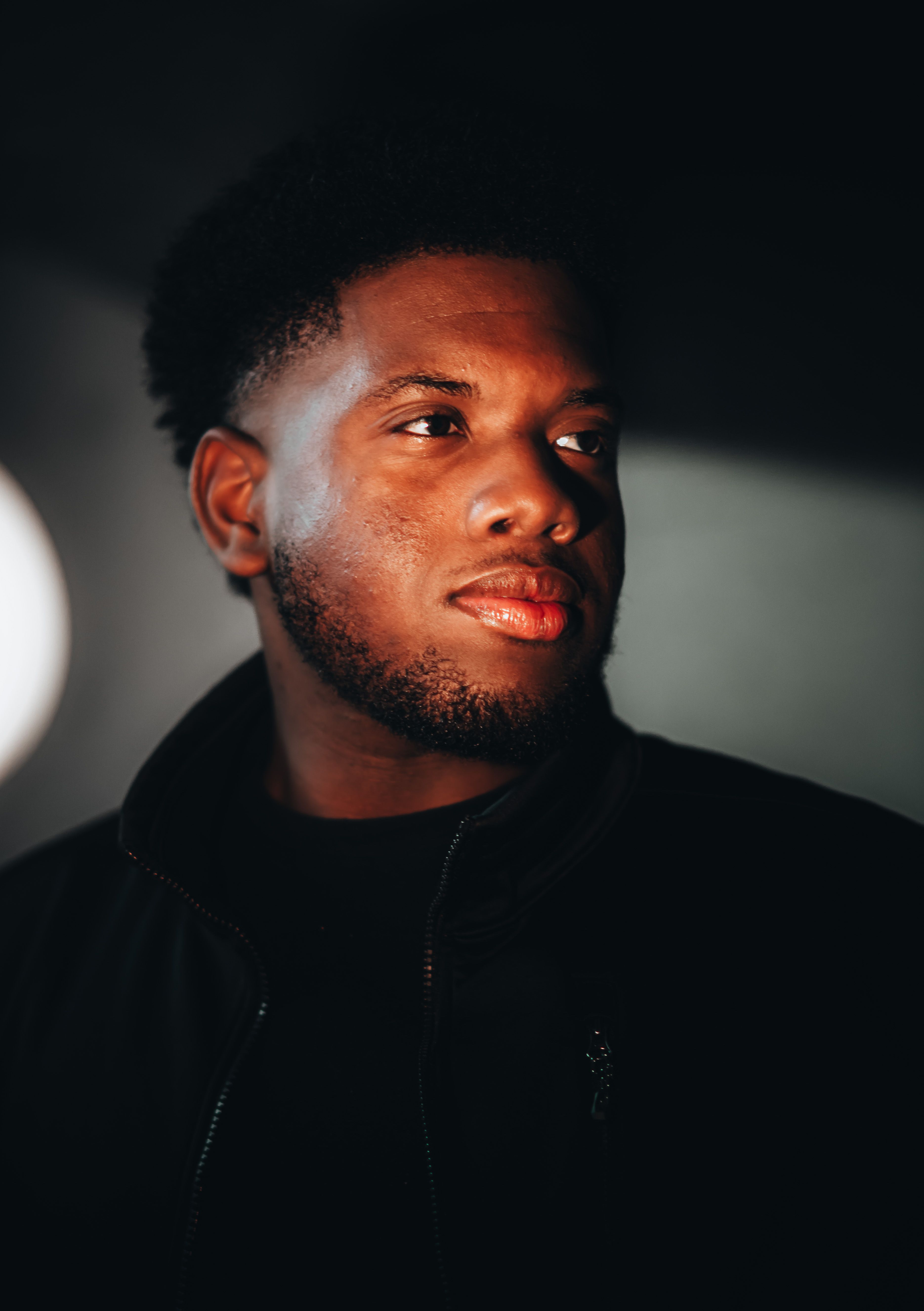 Portrait of a Young Man in Warm Light · Free Stock Photo