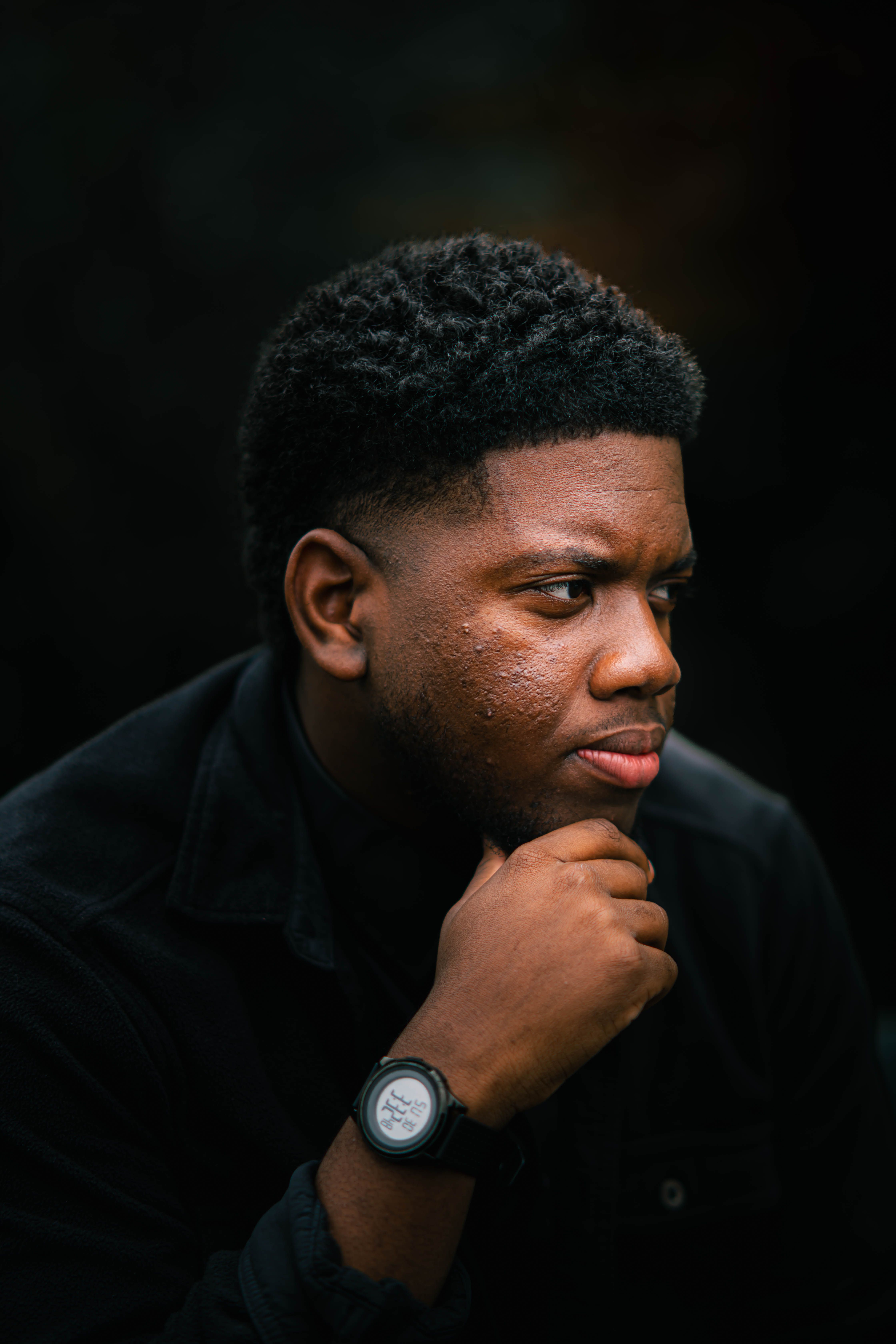 Thoughtful Portrait of a Man with Watch · Free Stock Photo