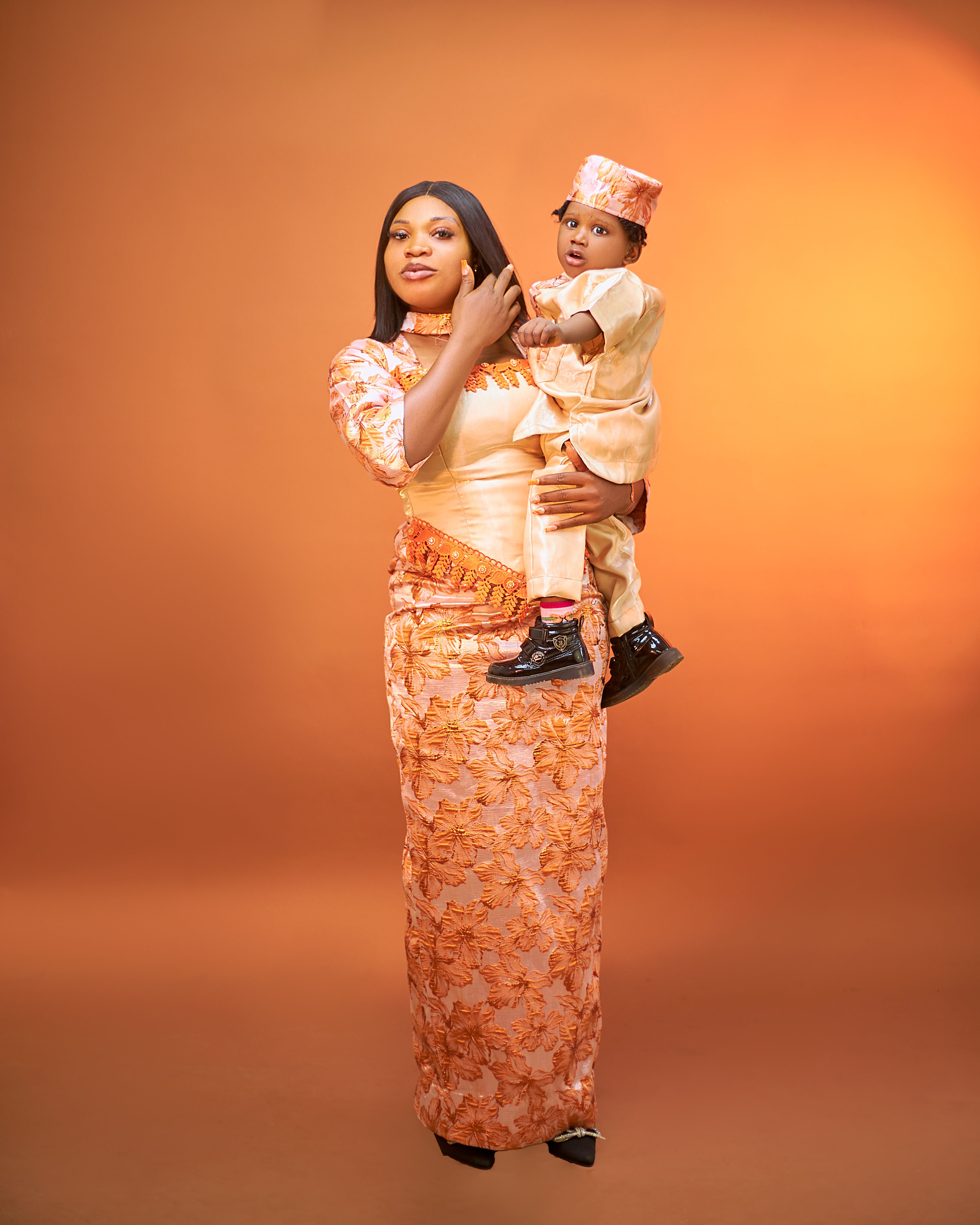 Elegant Traditional Attire of Mother and Child · Free Stock Photo