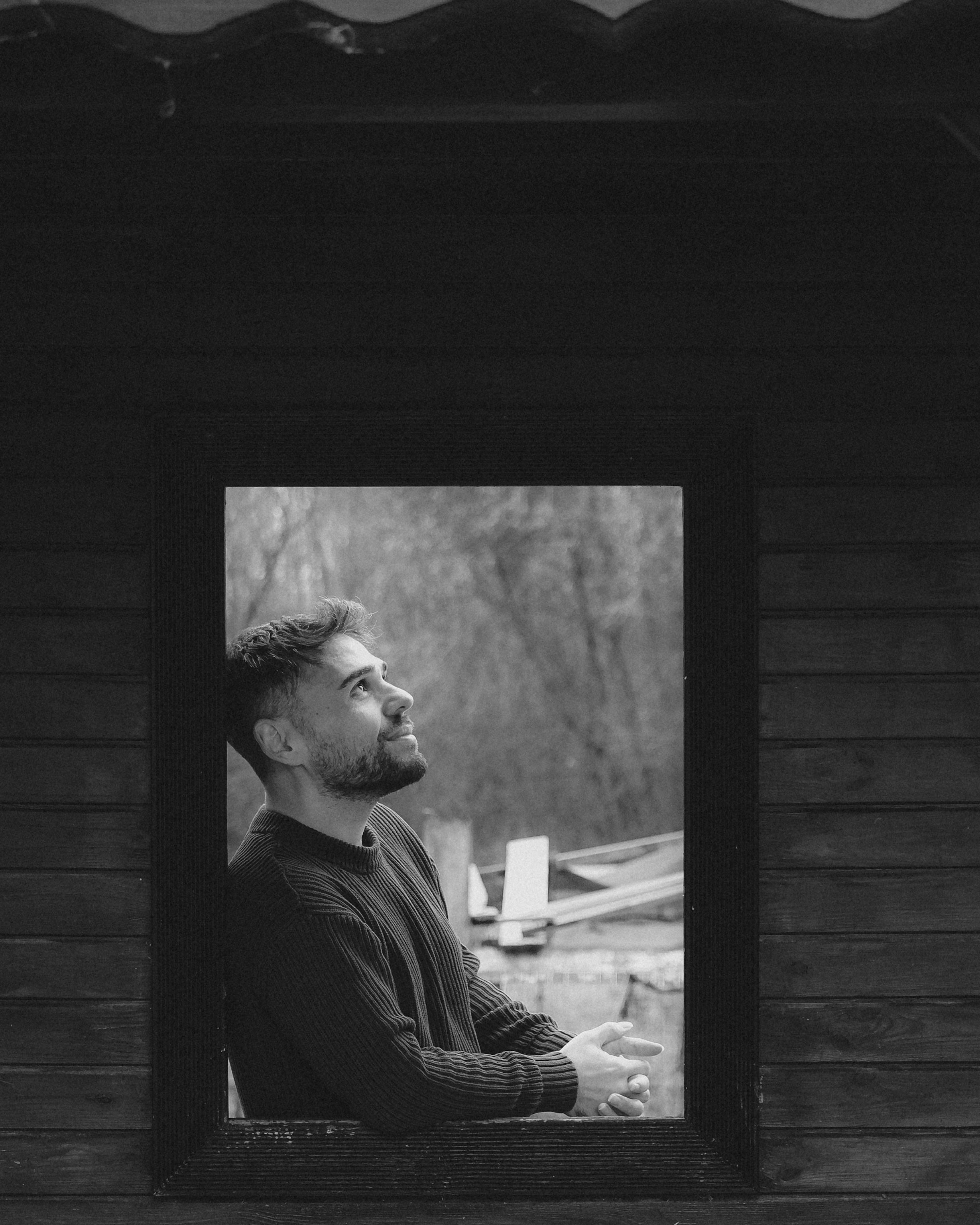Thoughtful Man Gazing Out of Window · Free Stock Photo