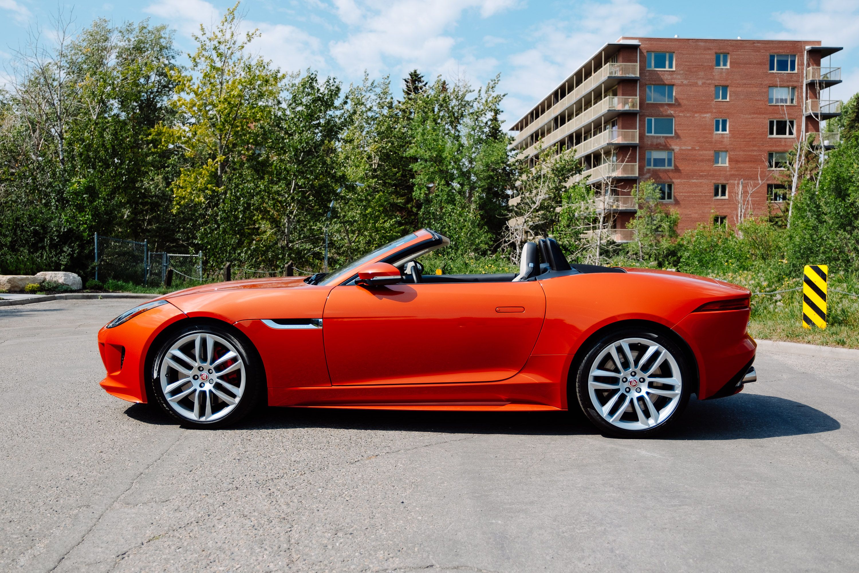 Bright Orange Convertible Sports Car on Urban Street · Free Stock Photo