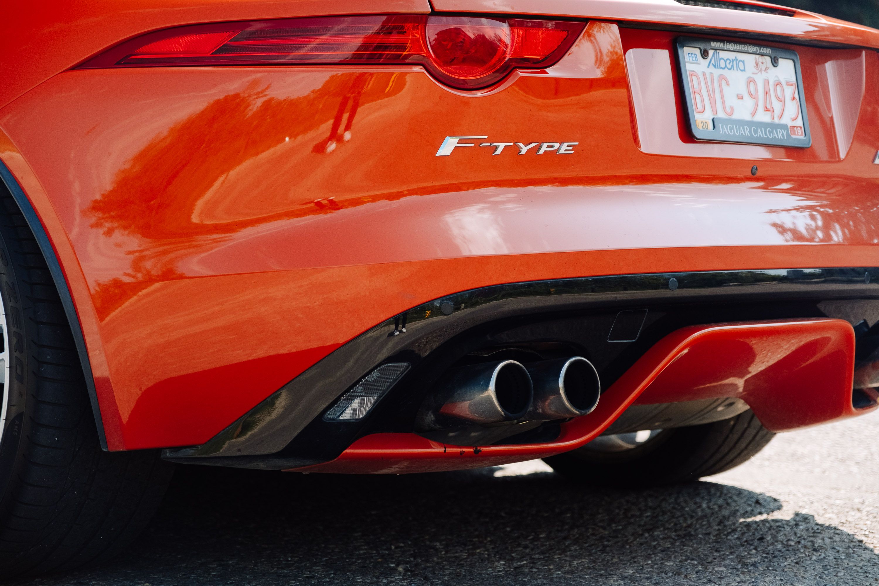 Rear View of Red Jaguar F-Type in Sunlight · Free Stock Photo
