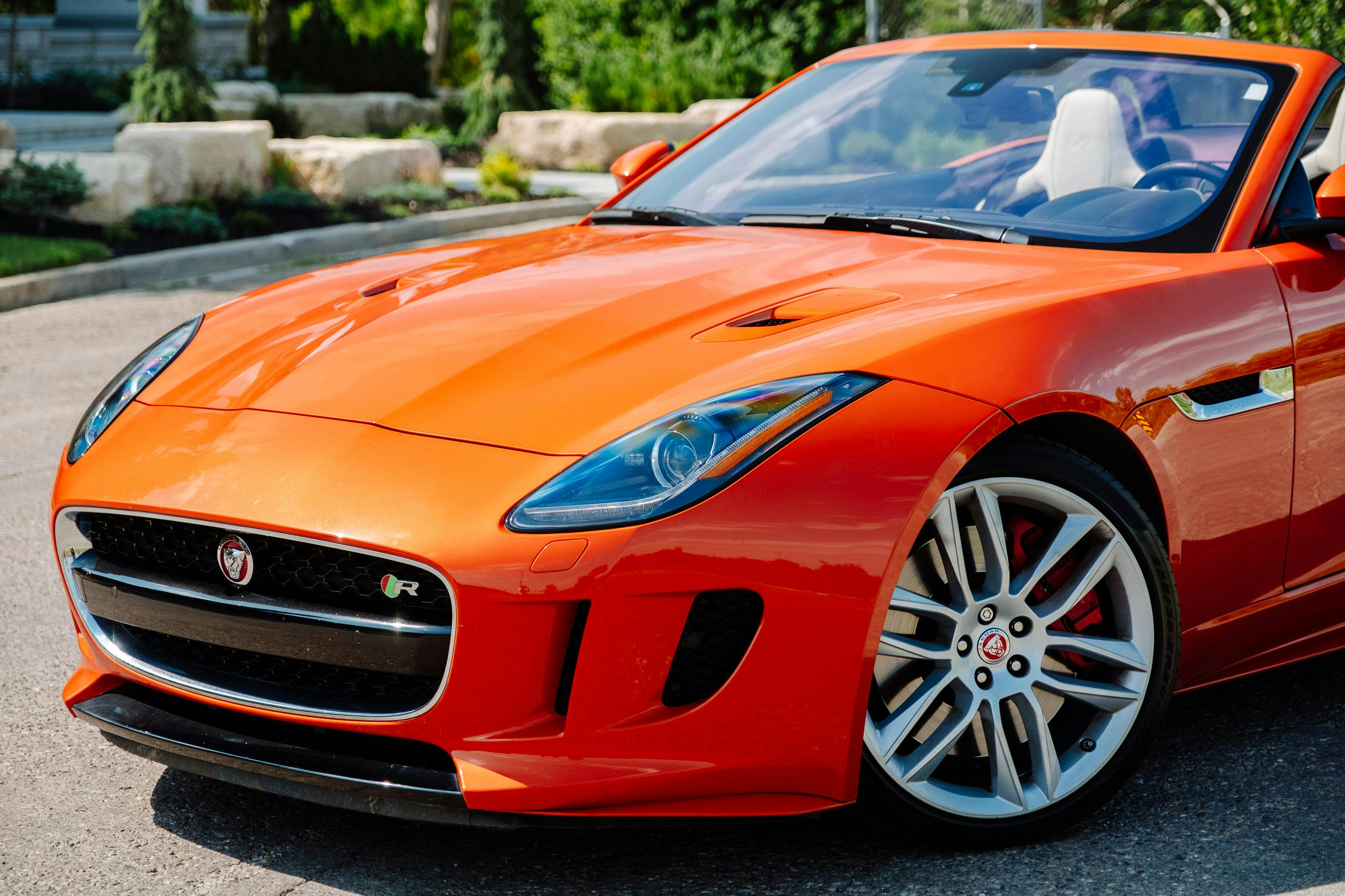 Vibrant Orange Jaguar Convertible Front View · Free Stock Photo