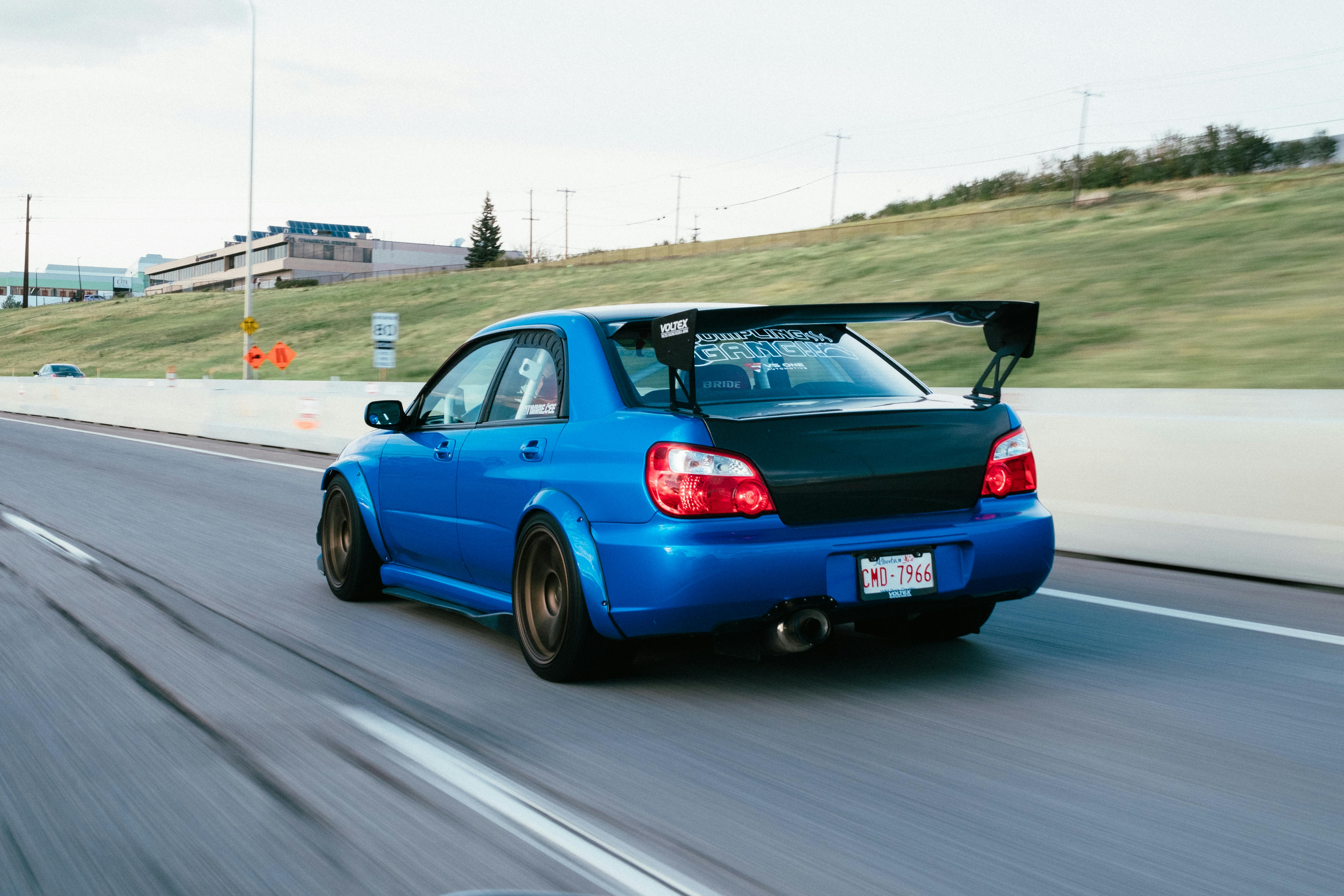 Subaru Sti Modificado En Color Azul Circulando Por La Autopista · Foto ...