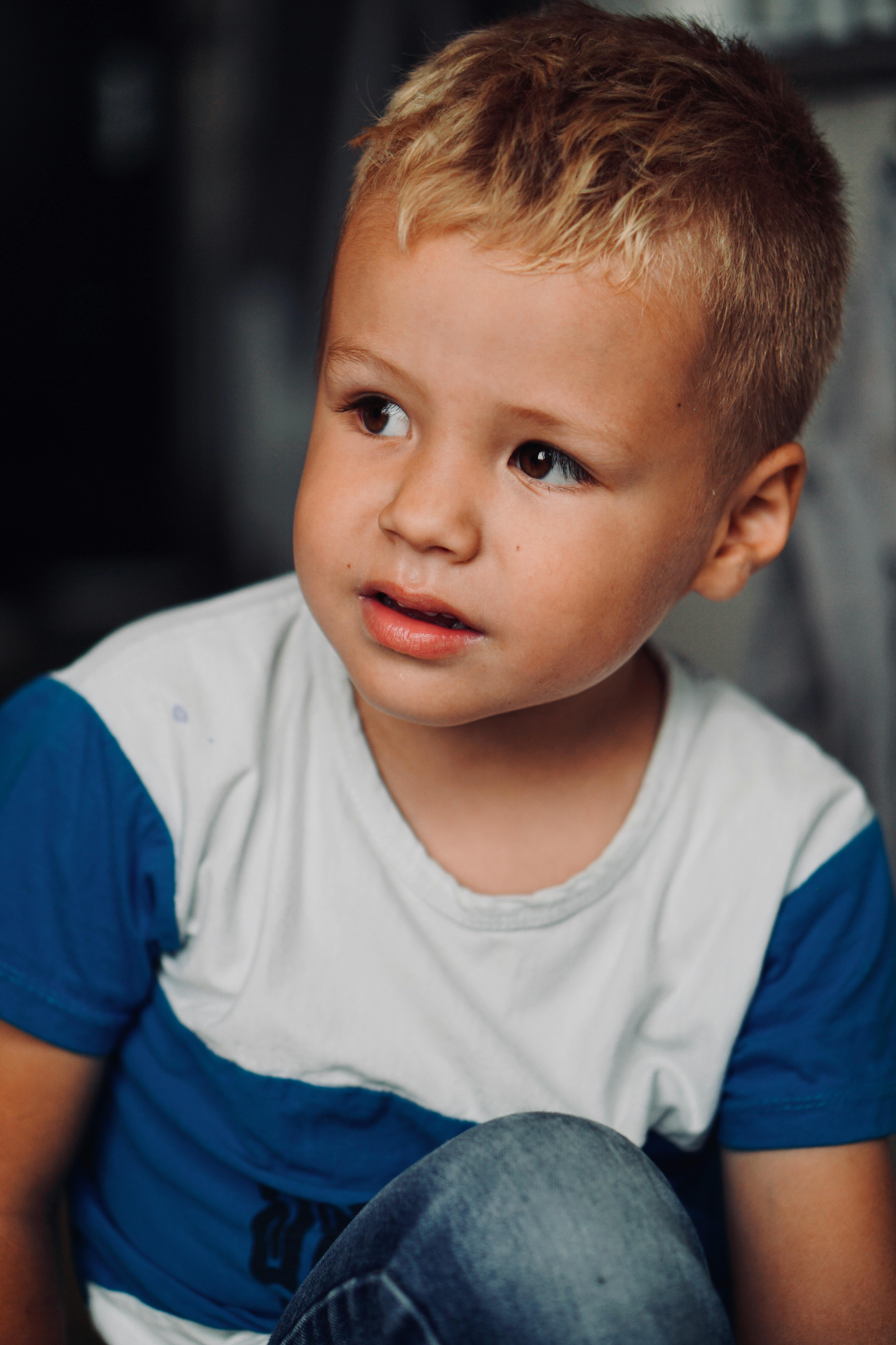 Portrait of a Young Child with Thoughtful Expression · Free Stock Photo