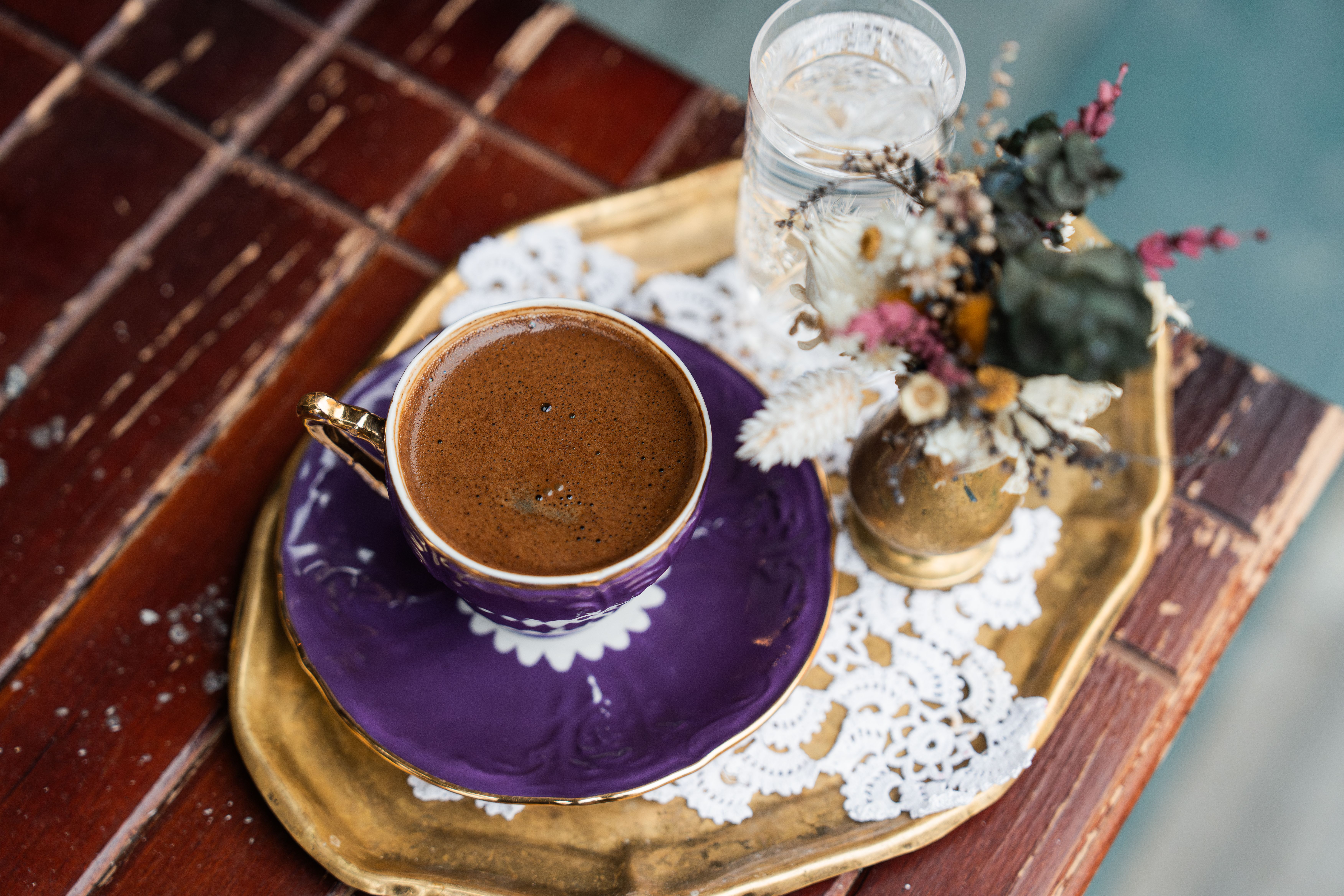 Elegant Coffee Setup with Purple Cup and Flowers · Free Stock Photo