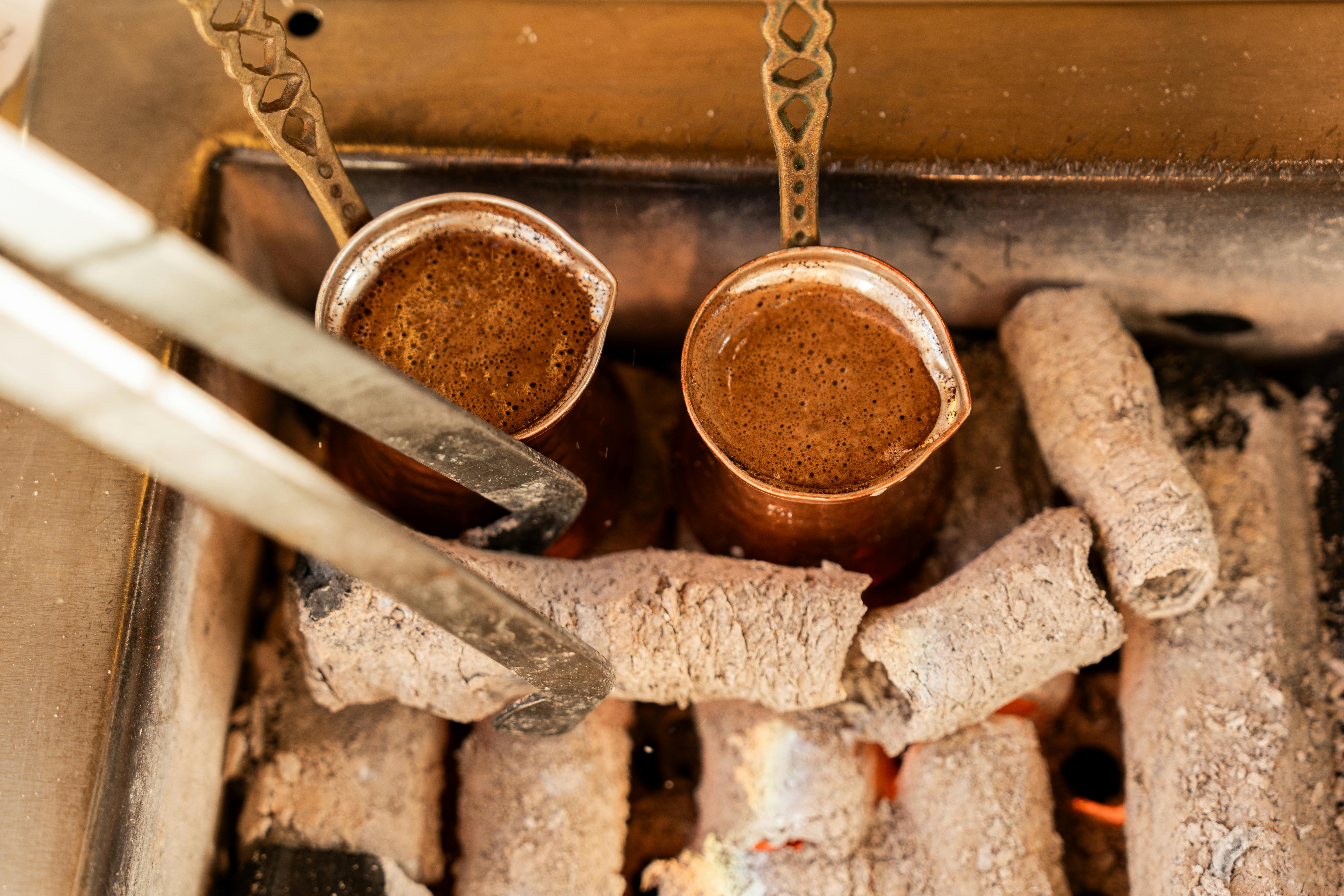 Traditional Turkish Coffee Brewing Over Coals · Free Stock Photo