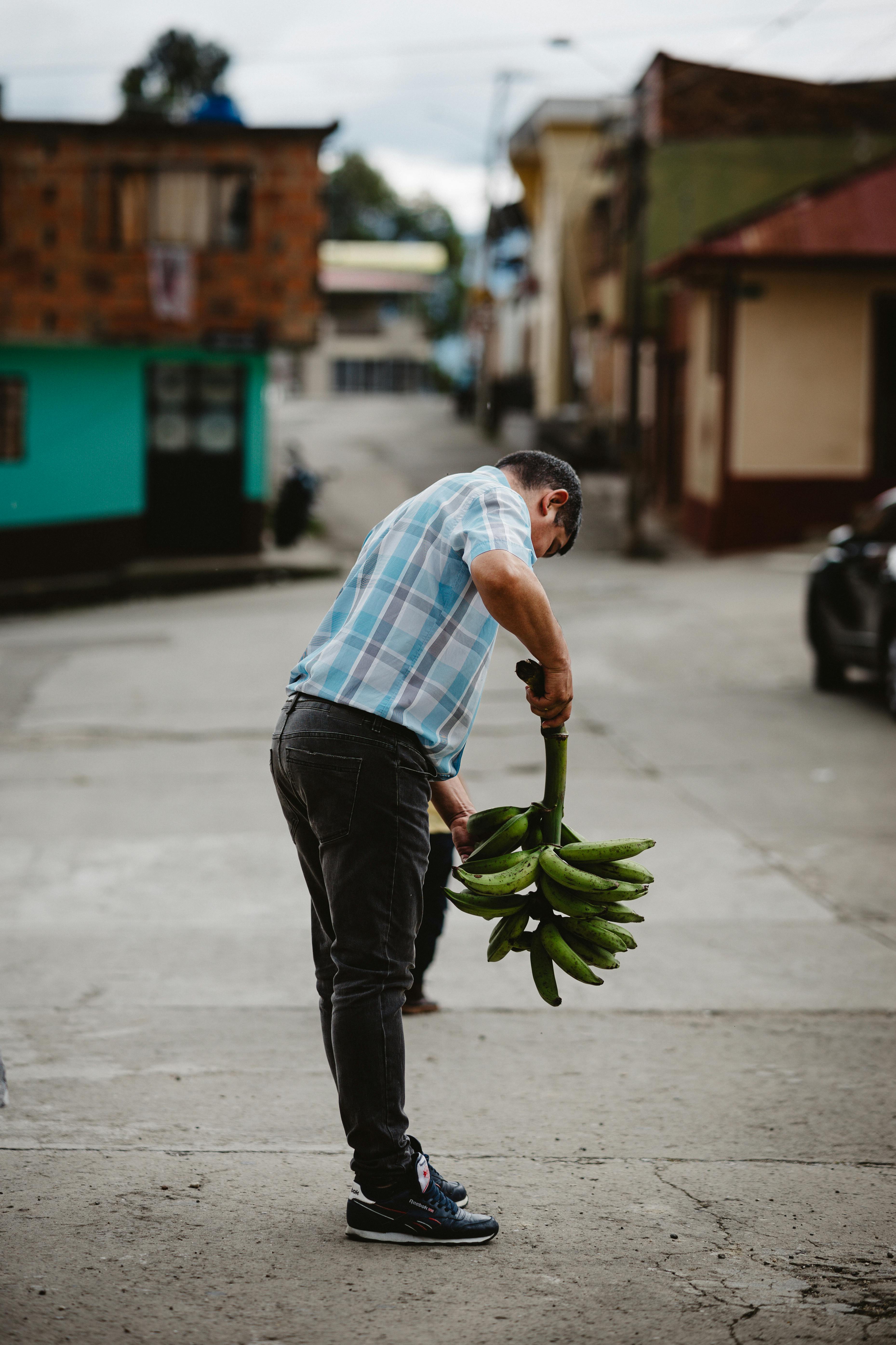 Man Carrying Plantains in Colombian Street · Free Stock Photo
