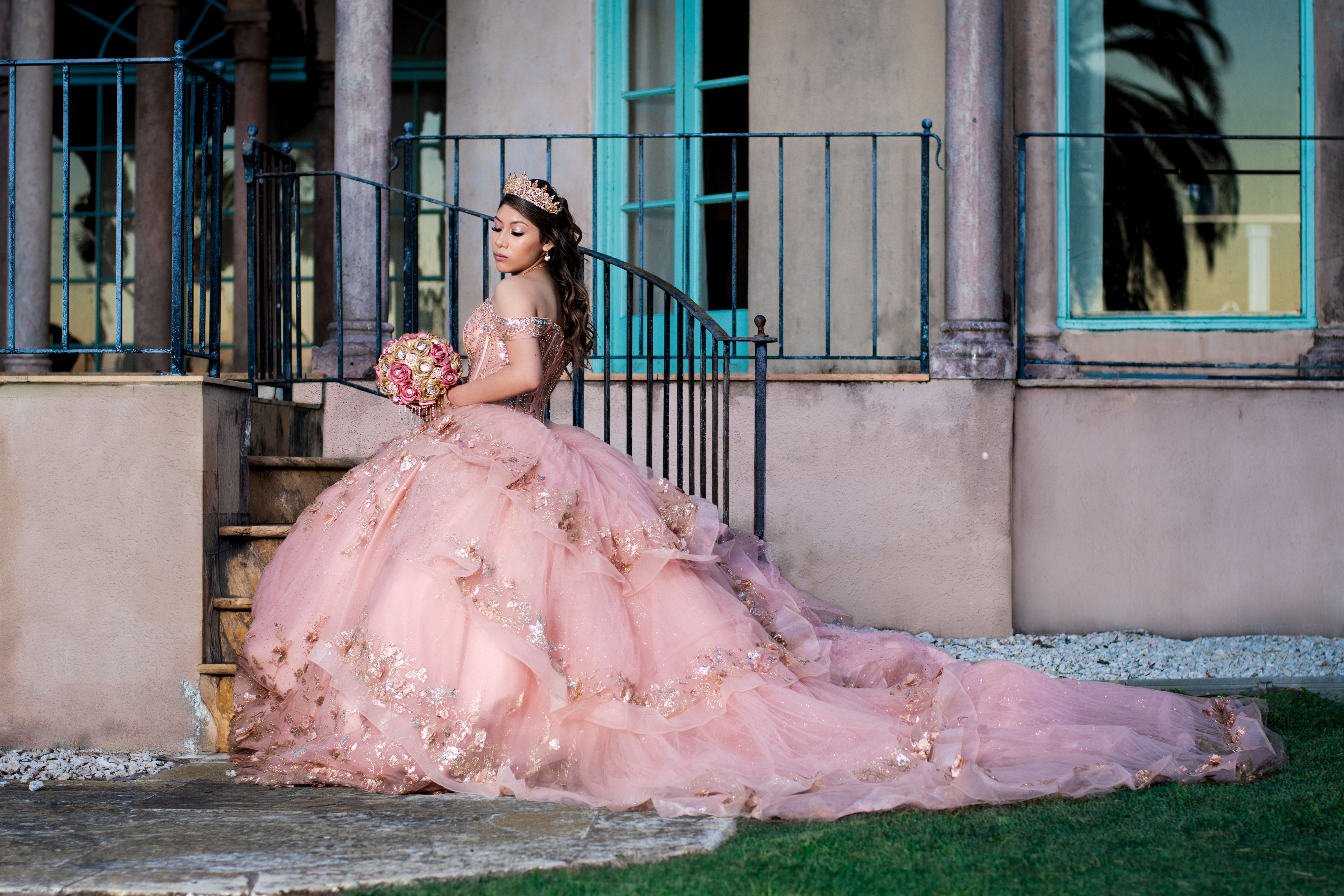 Quinceañera in Elegant Pink Gown Outside Castle · Free Stock Photo