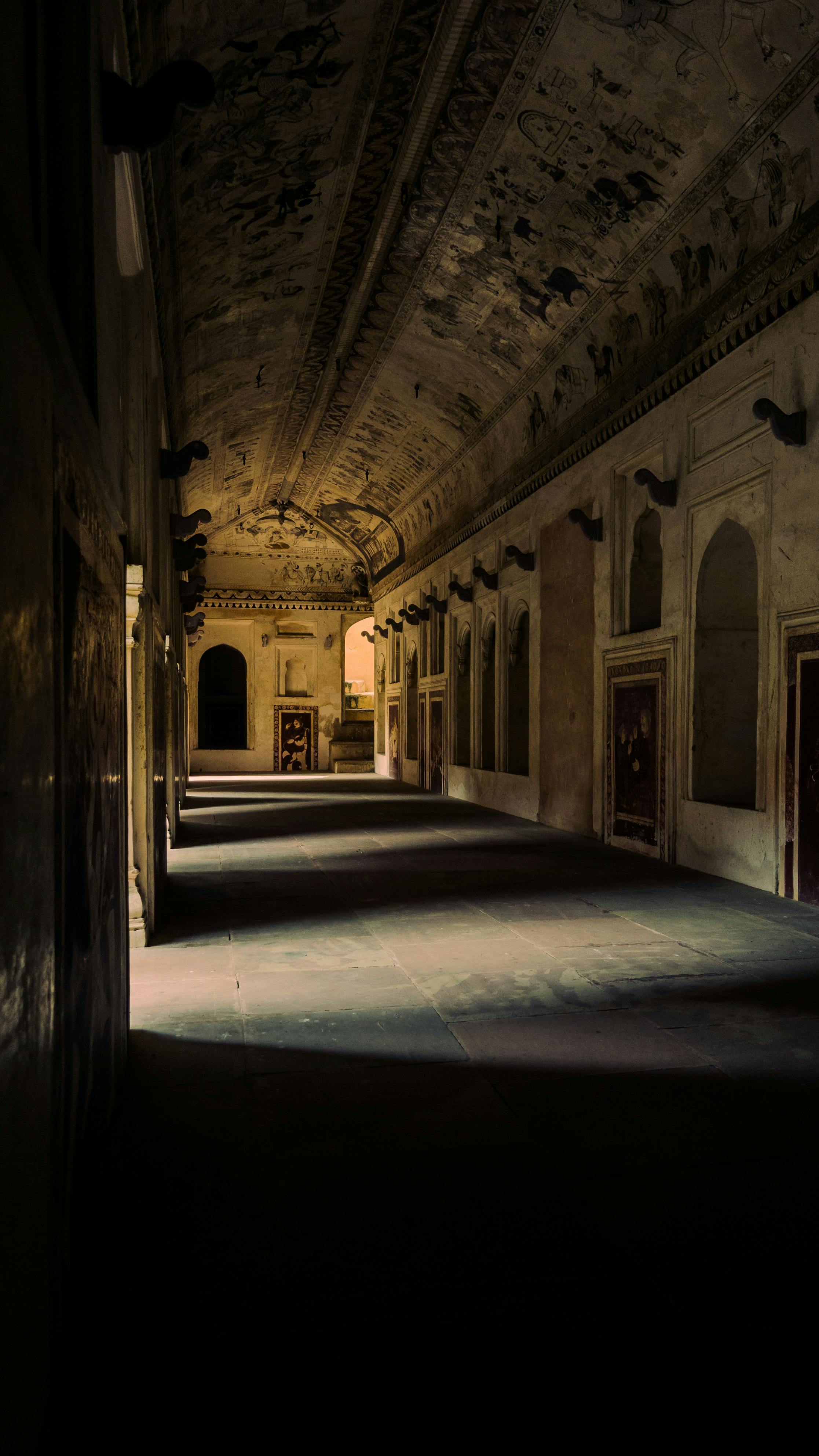 Historic Indoor Corridor with Dim Lighting · Free Stock Photo