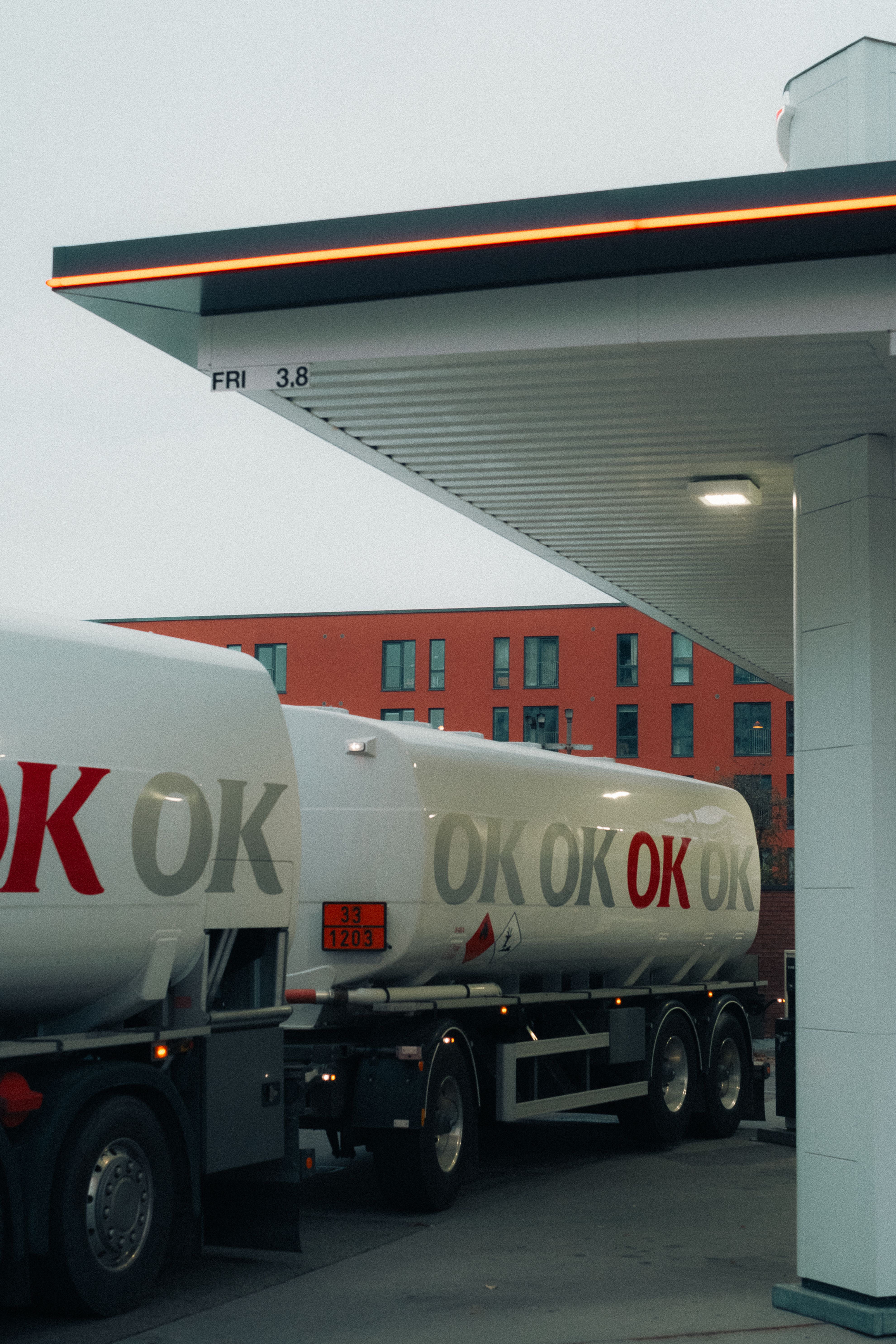 Fuel tanker truck at a modern gas station · Free Stock Photo