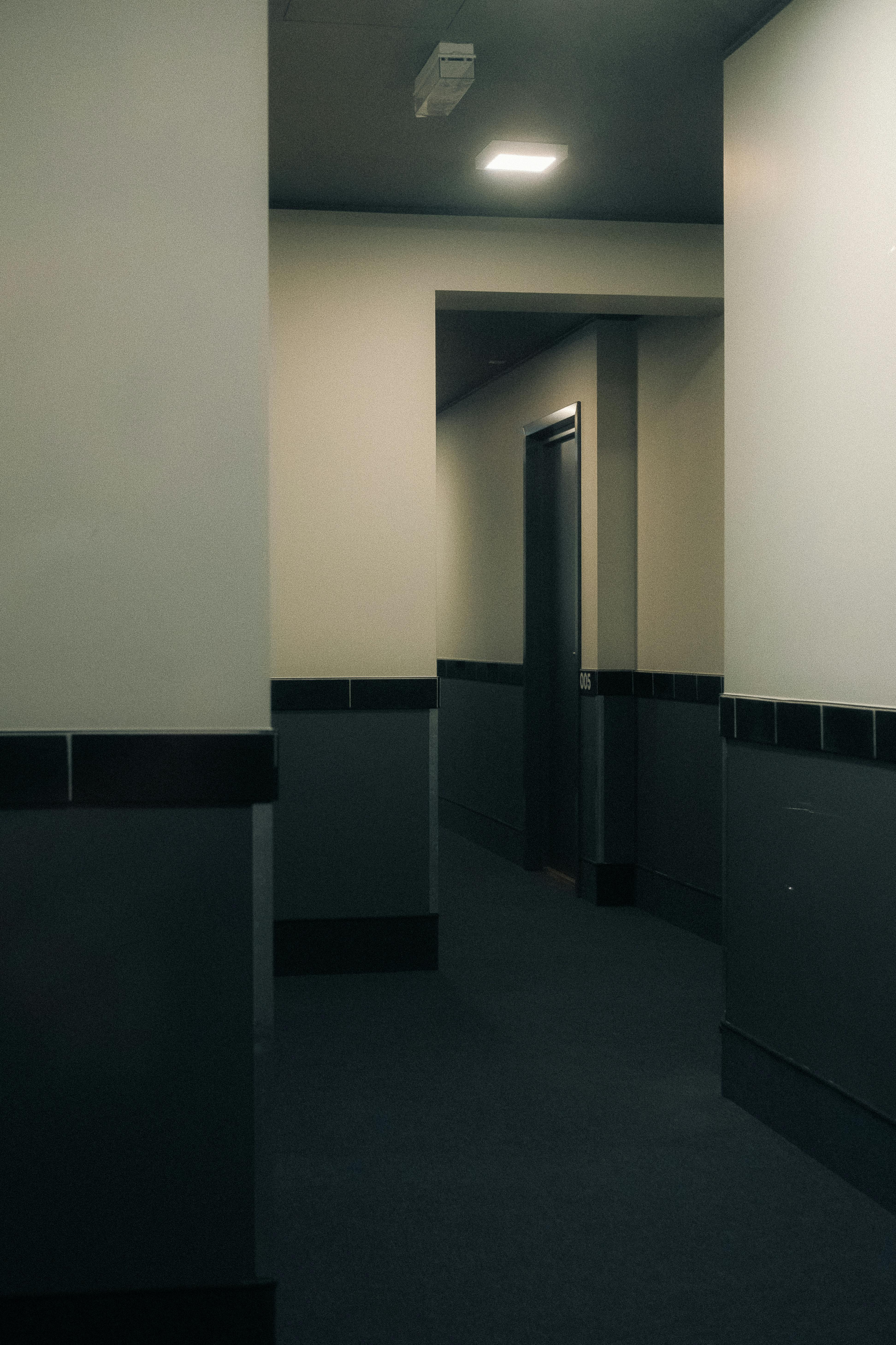 Minimalist Urban Hallway with Dramatic Lighting · Free Stock Photo