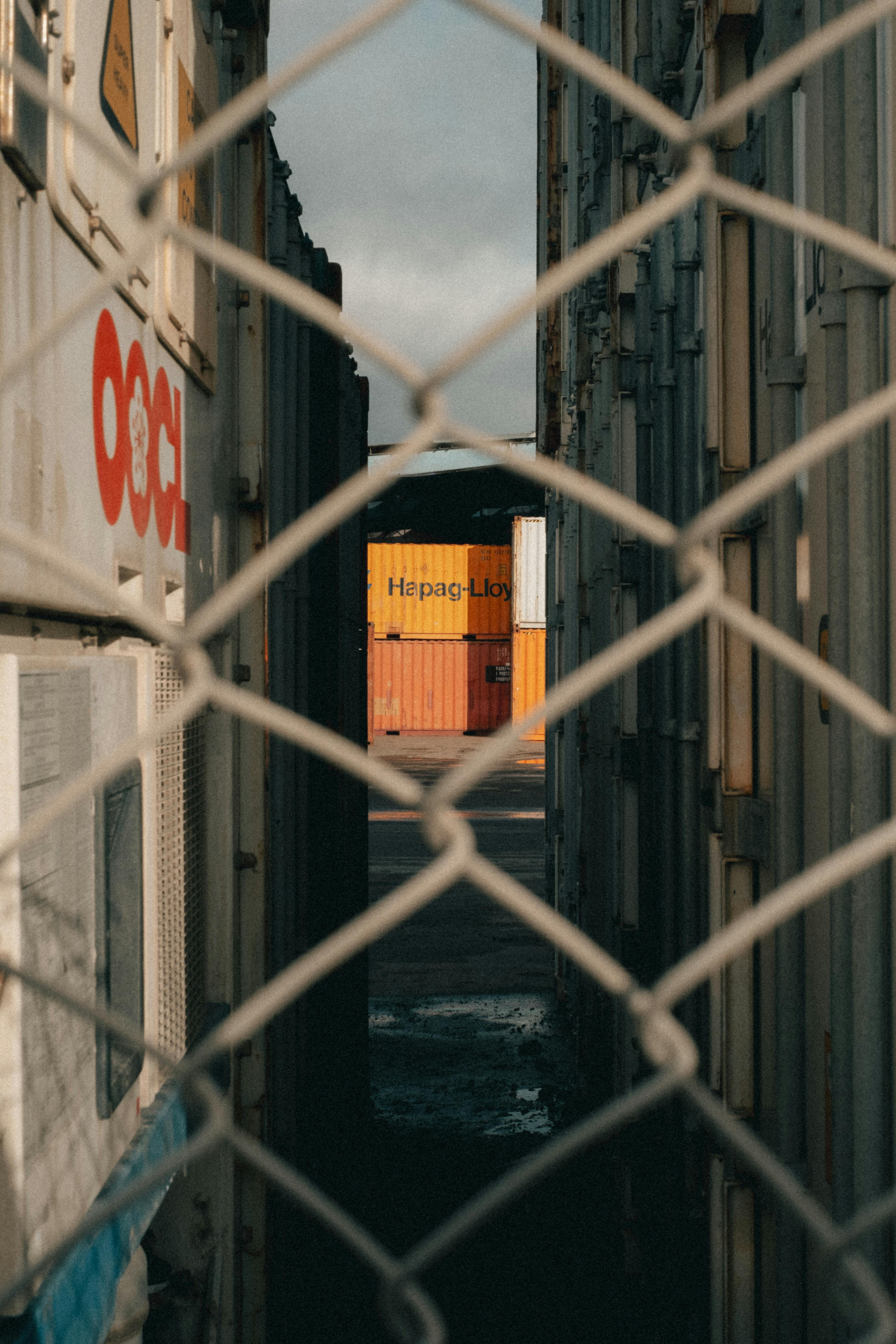 Industrial Shipping Containers with Fence View · Free Stock Photo