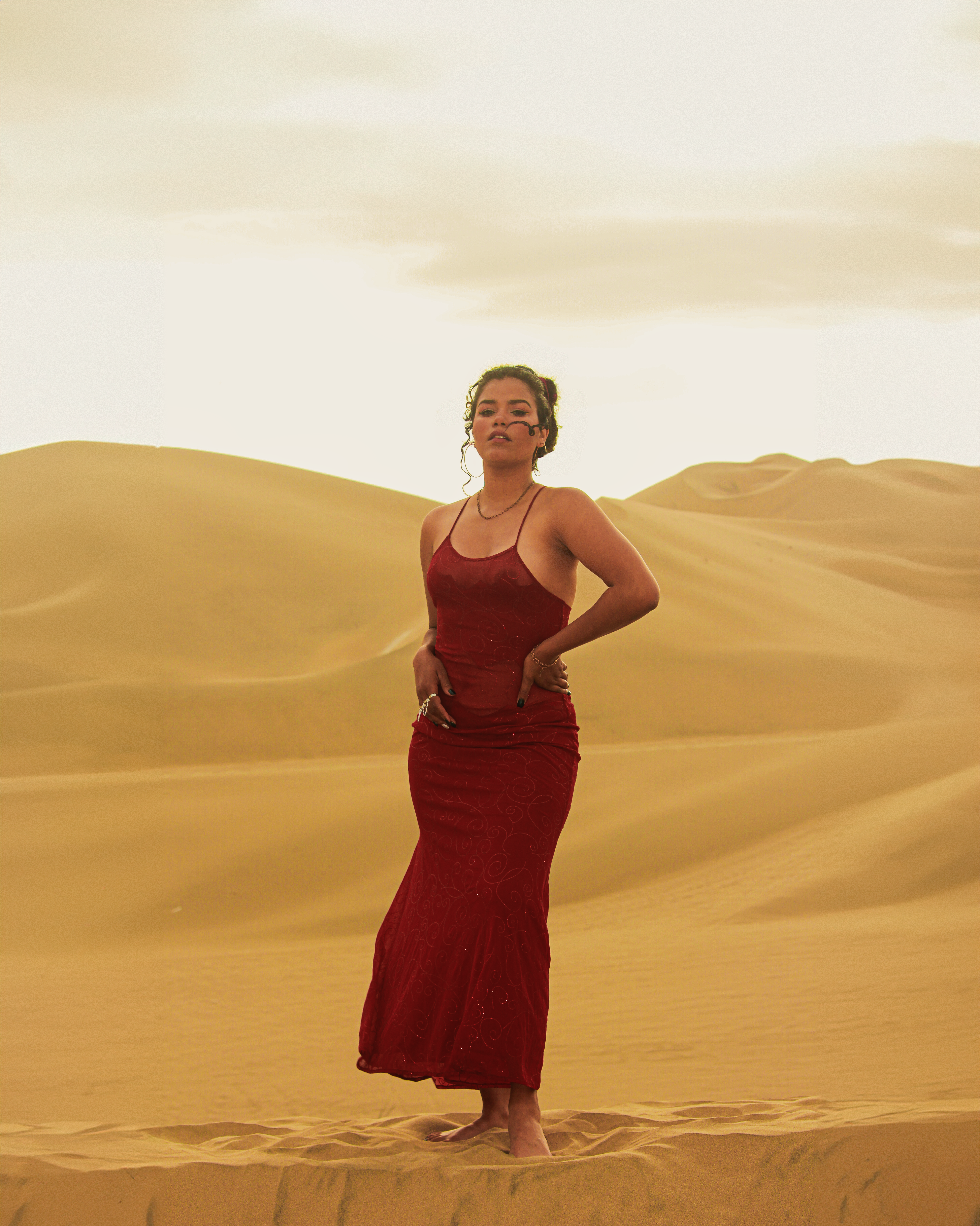 Elegant Woman in Red Dress Amidst Golden Desert · Free Stock Photo