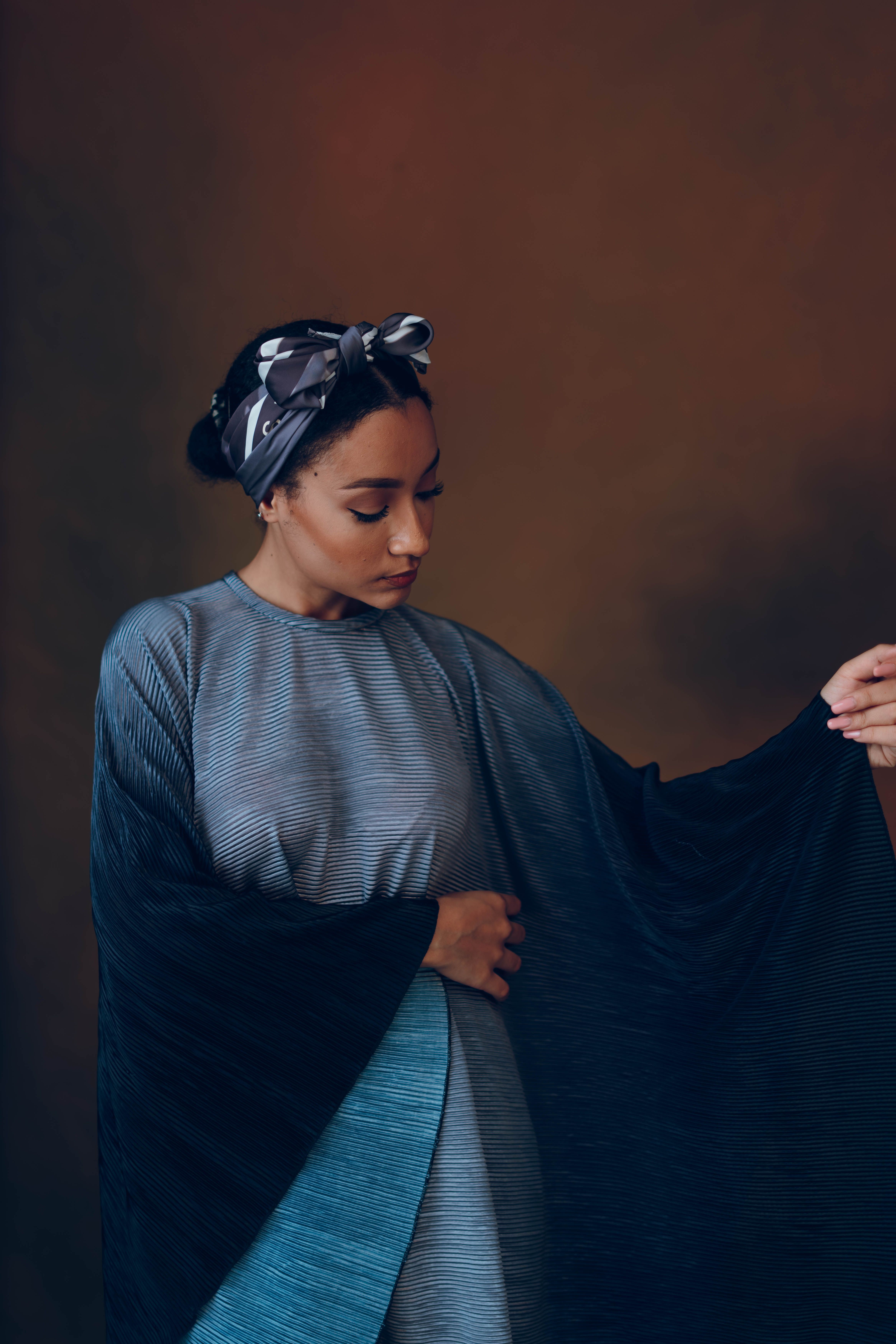Elegant Portrait of Woman in Flowing Blue Dress · Free Stock Photo