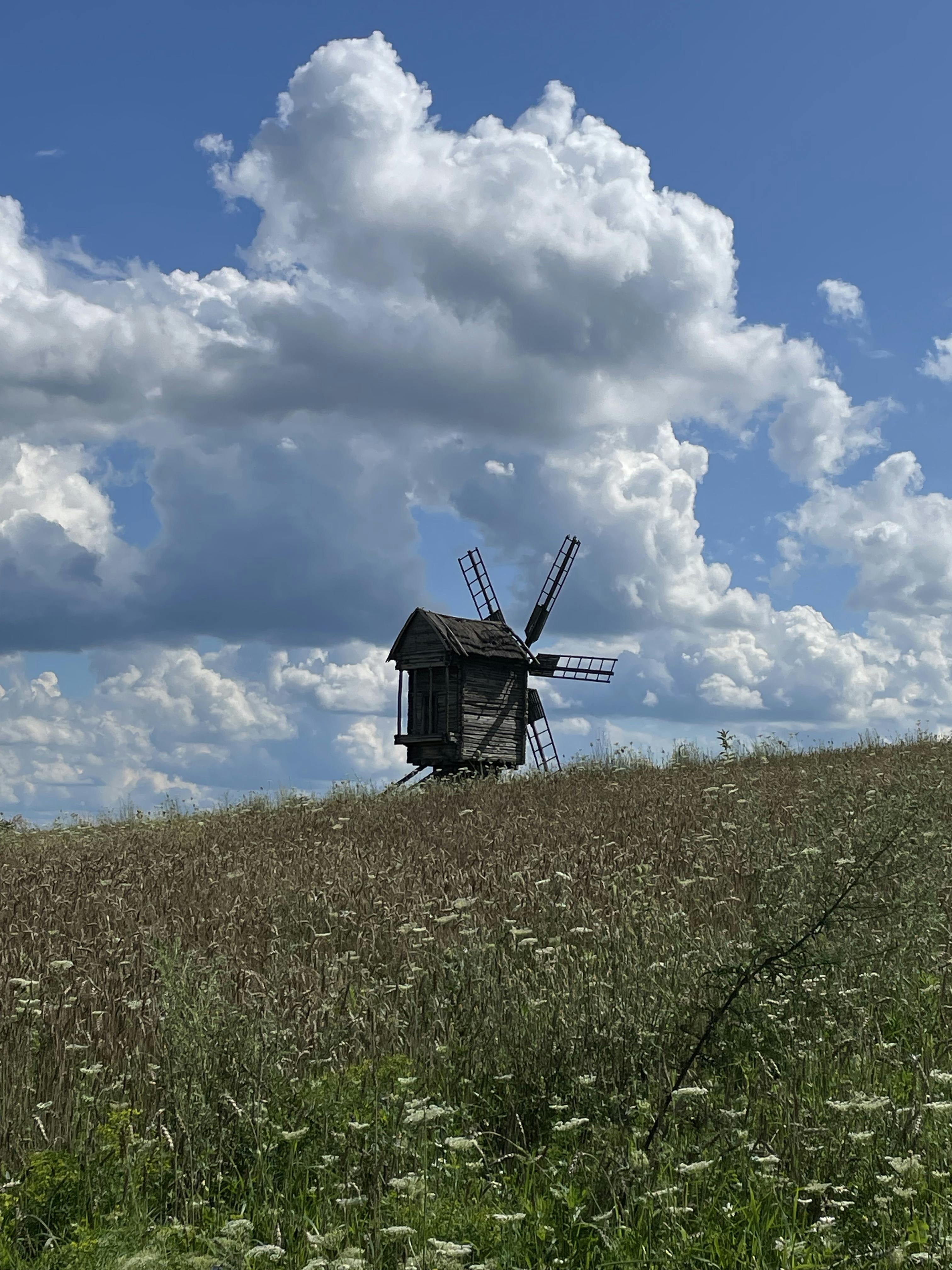 Rustic Windmill in Rolling Countryside Landscape · Free Stock Photo