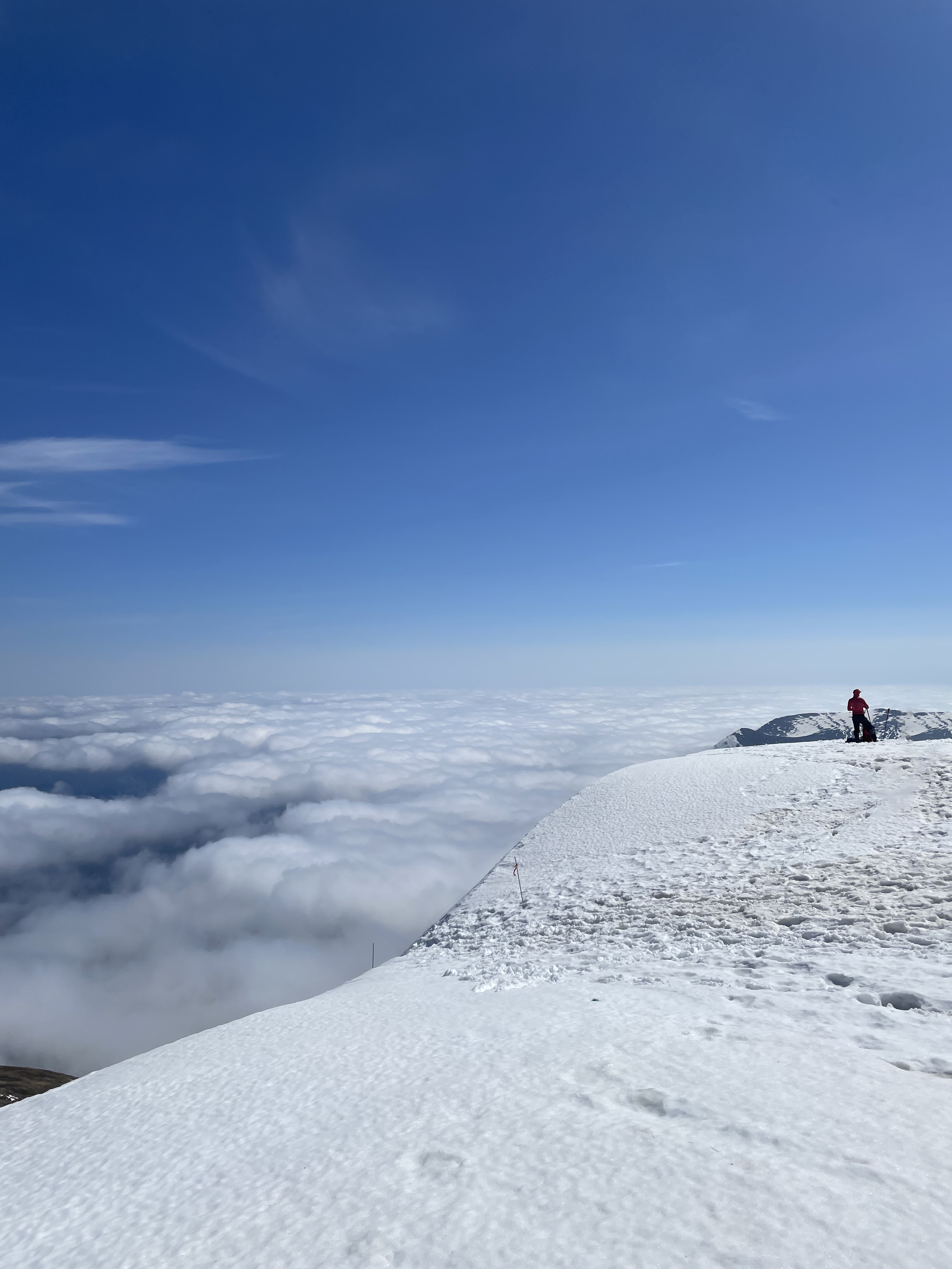 Majestic Snowy Mountain Summit with Hiker · Free Stock Photo
