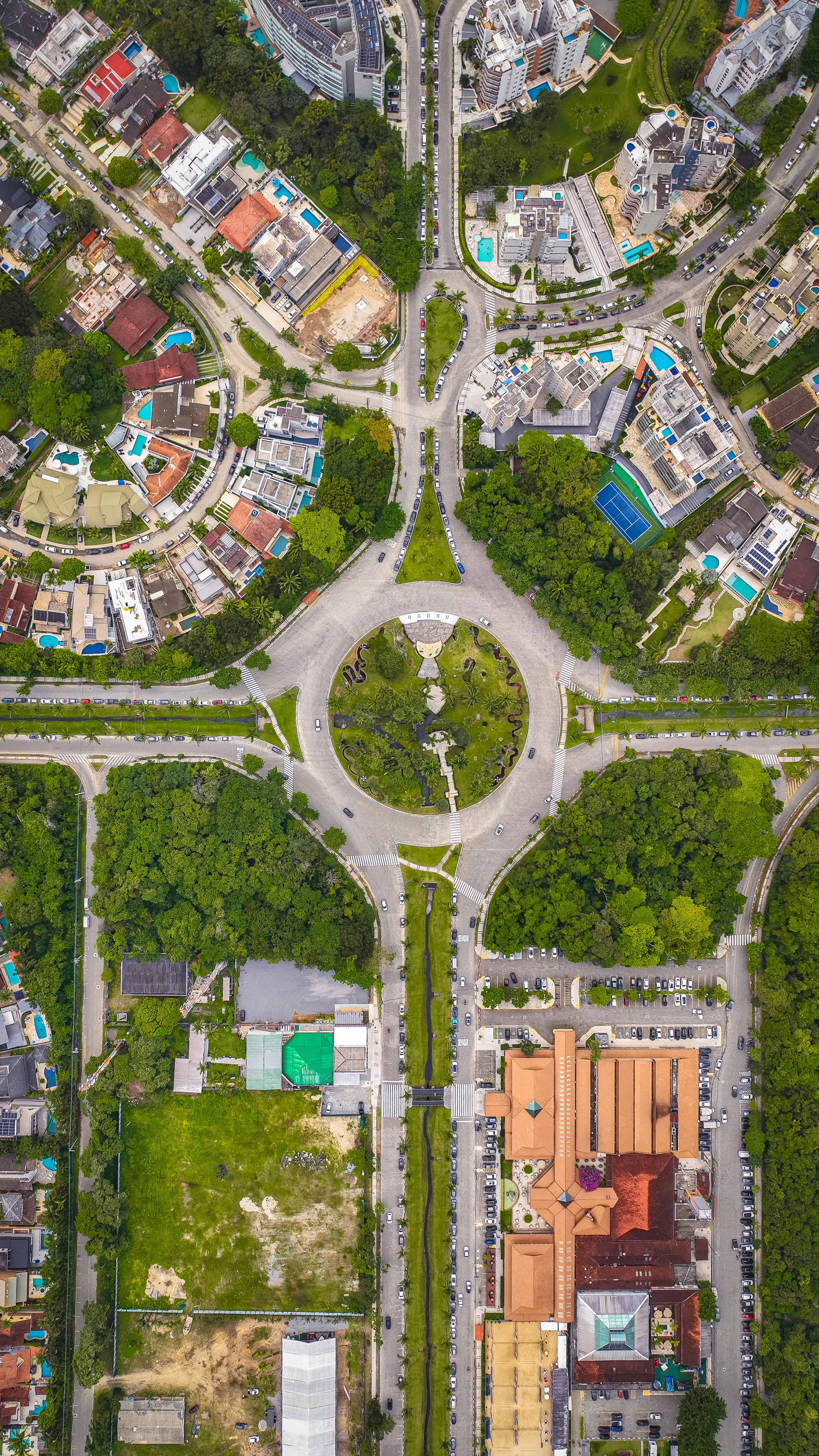 Aerial View of Urban Roundabout and Green Landscape · Free Stock Photo