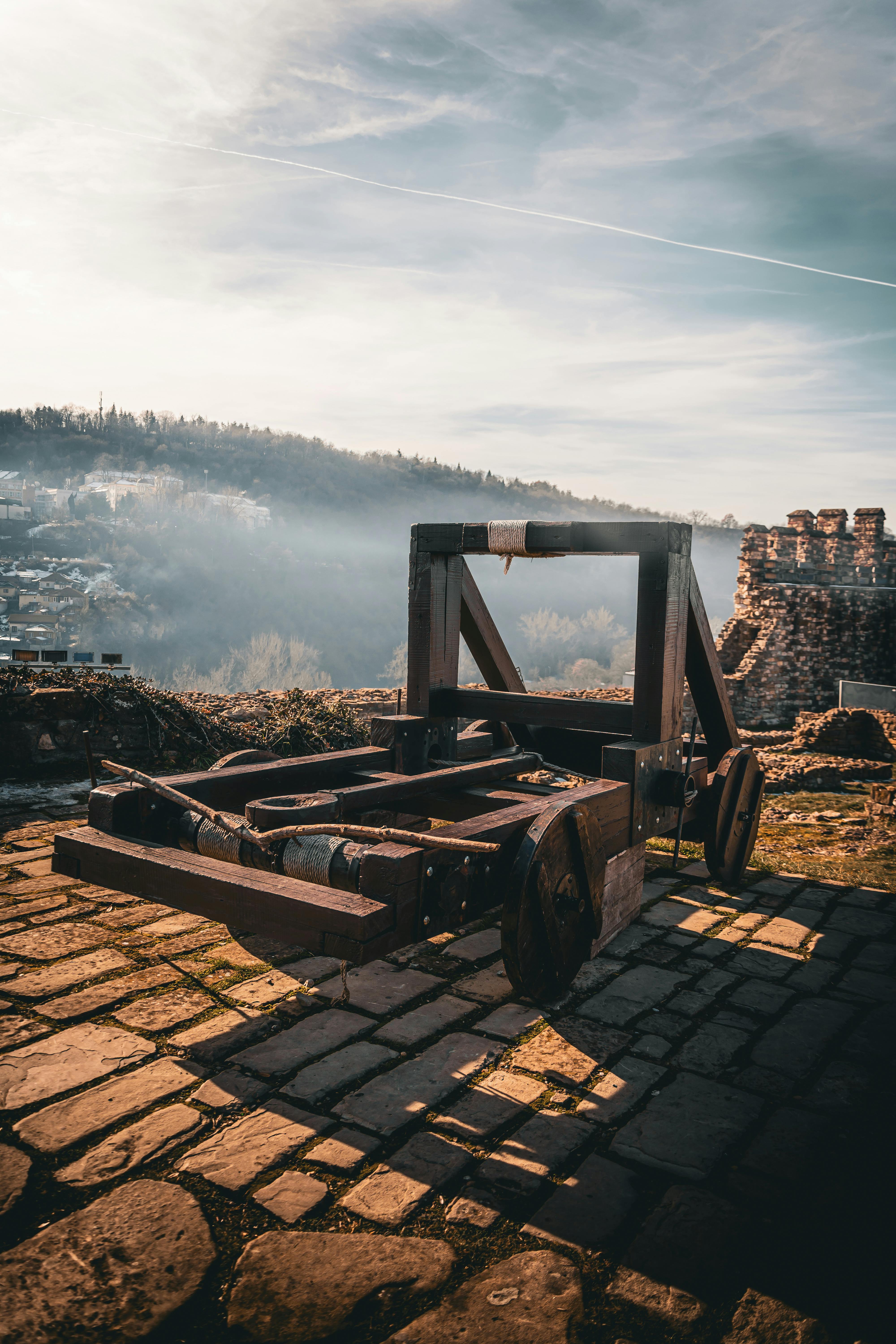 Ancient Catapult on Stone Fortress in Scenic View · Free Stock Photo