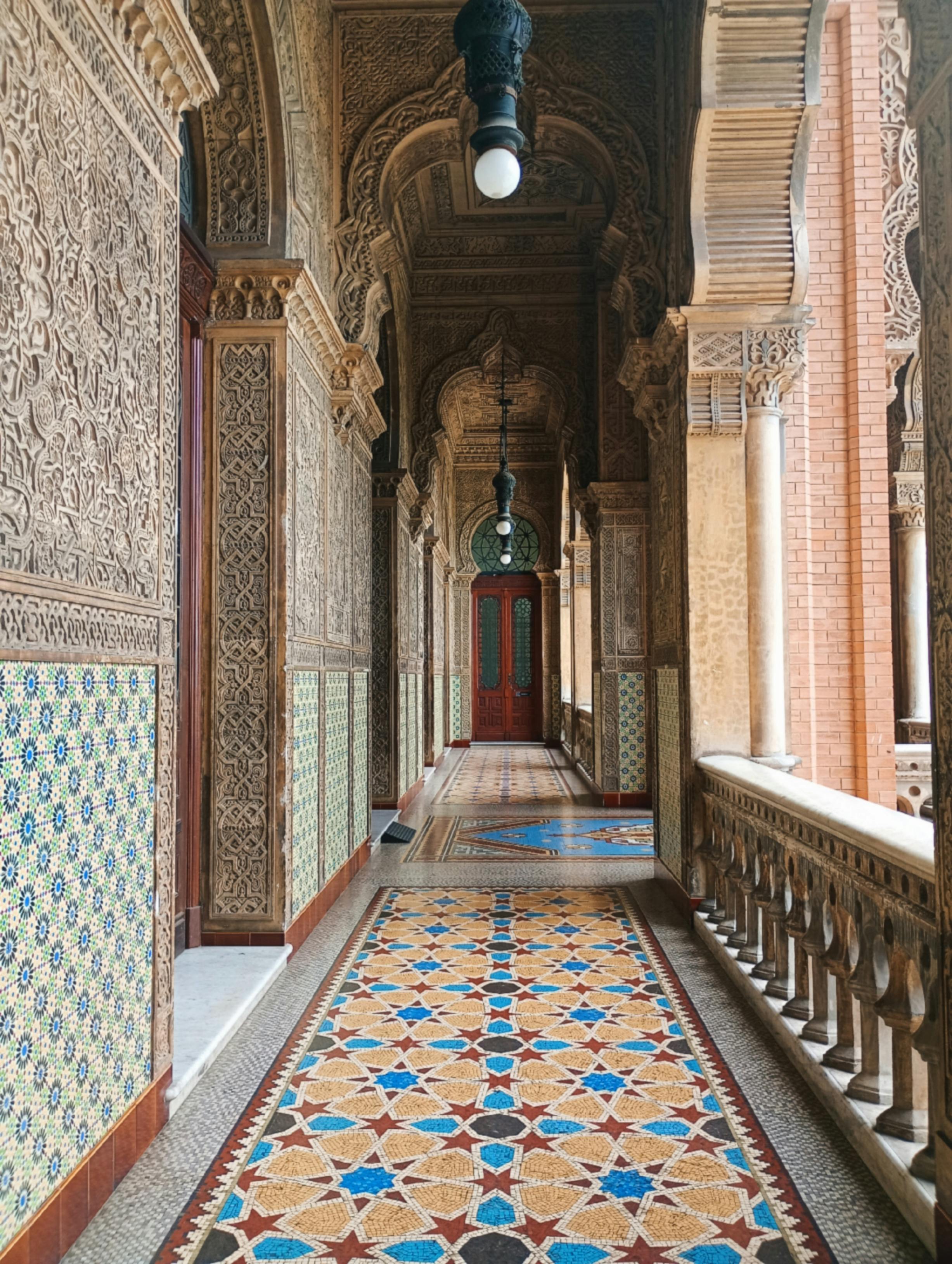 Ornate Corridor with Intricate Patterns · Free Stock Photo