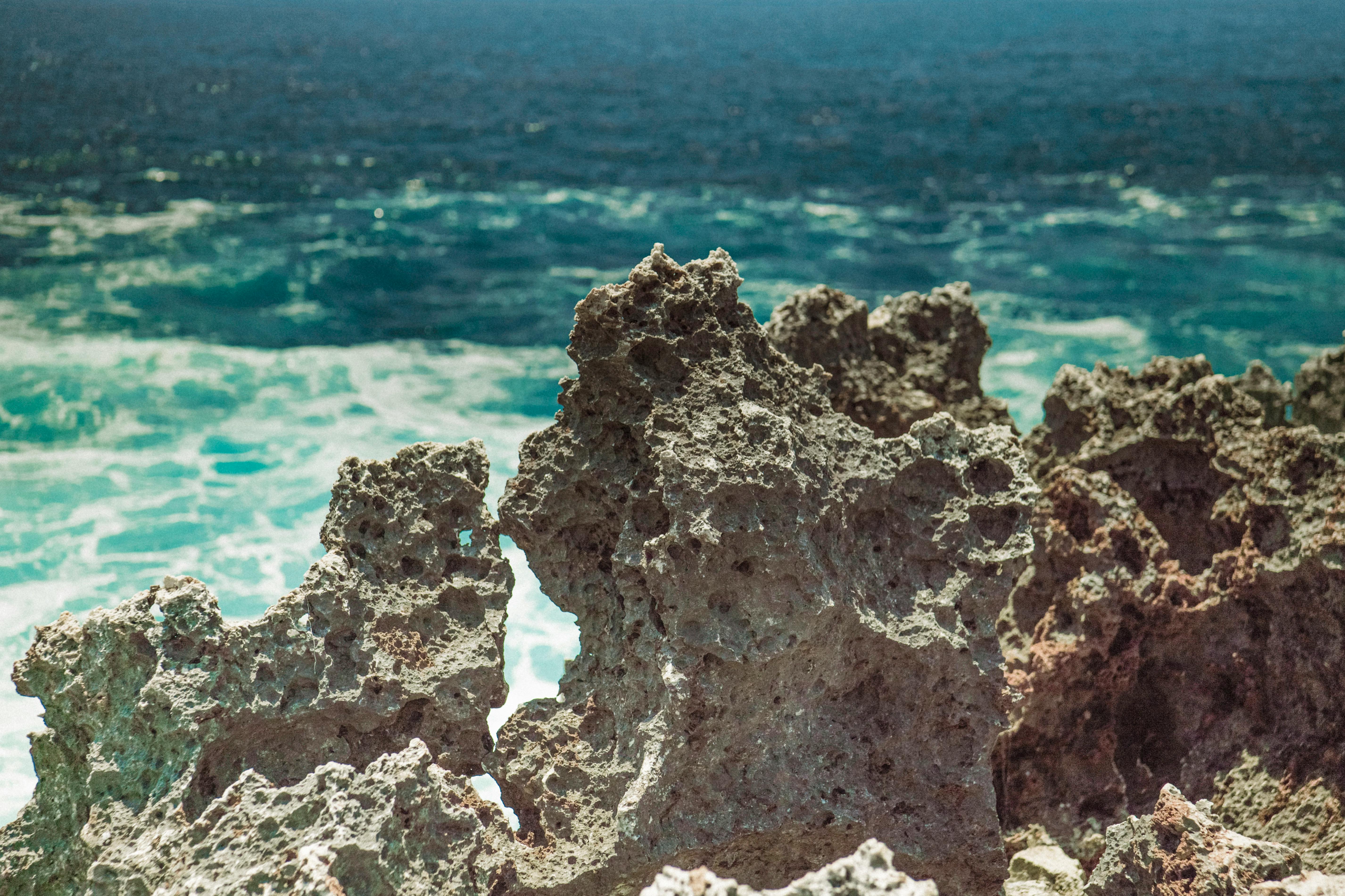 Top View Photo of Rock Formation on Body of Water · Free Stock Photo