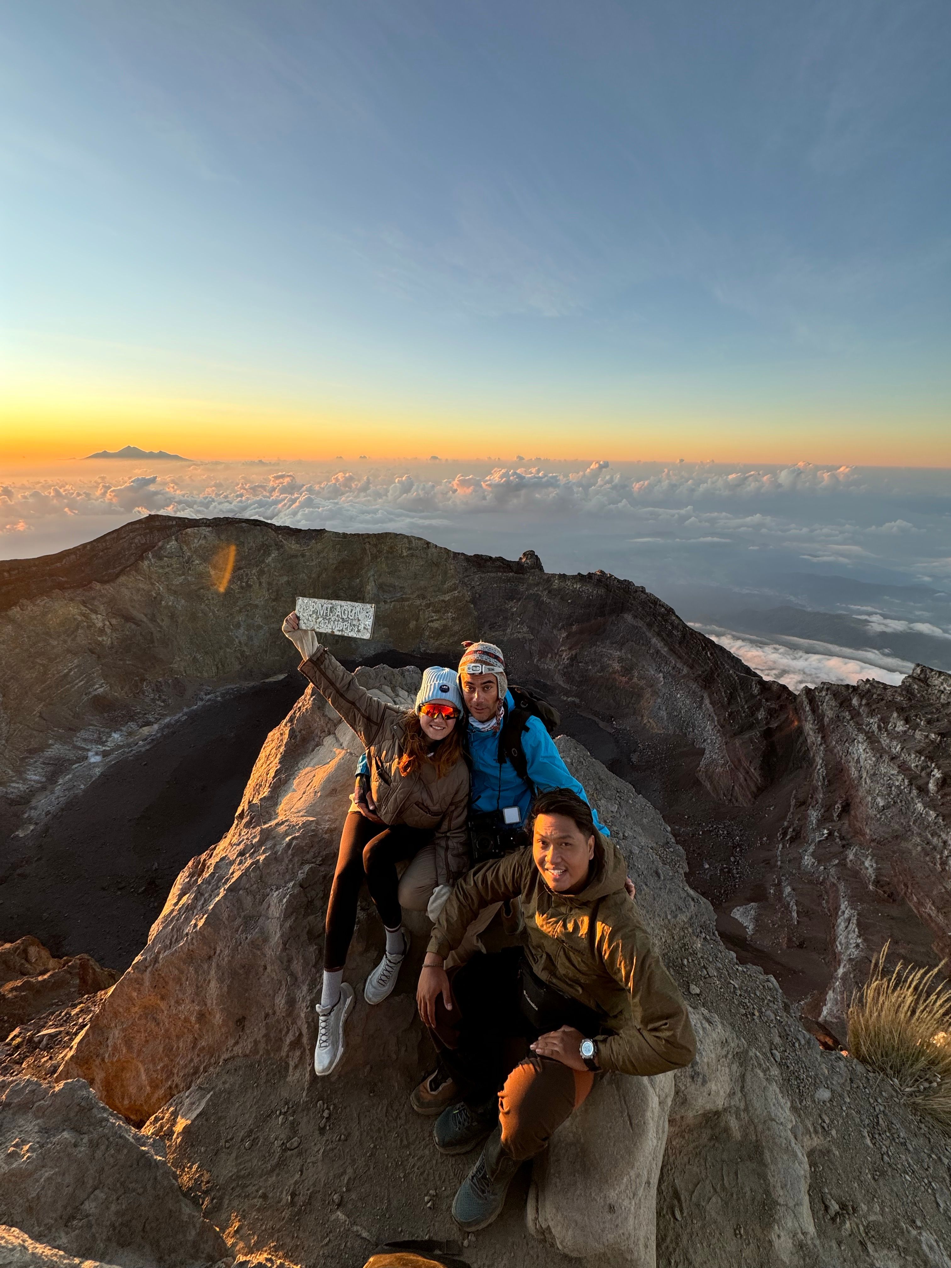 Group Celebrating on Volcano Summit at Sunrise · Free Stock Photo