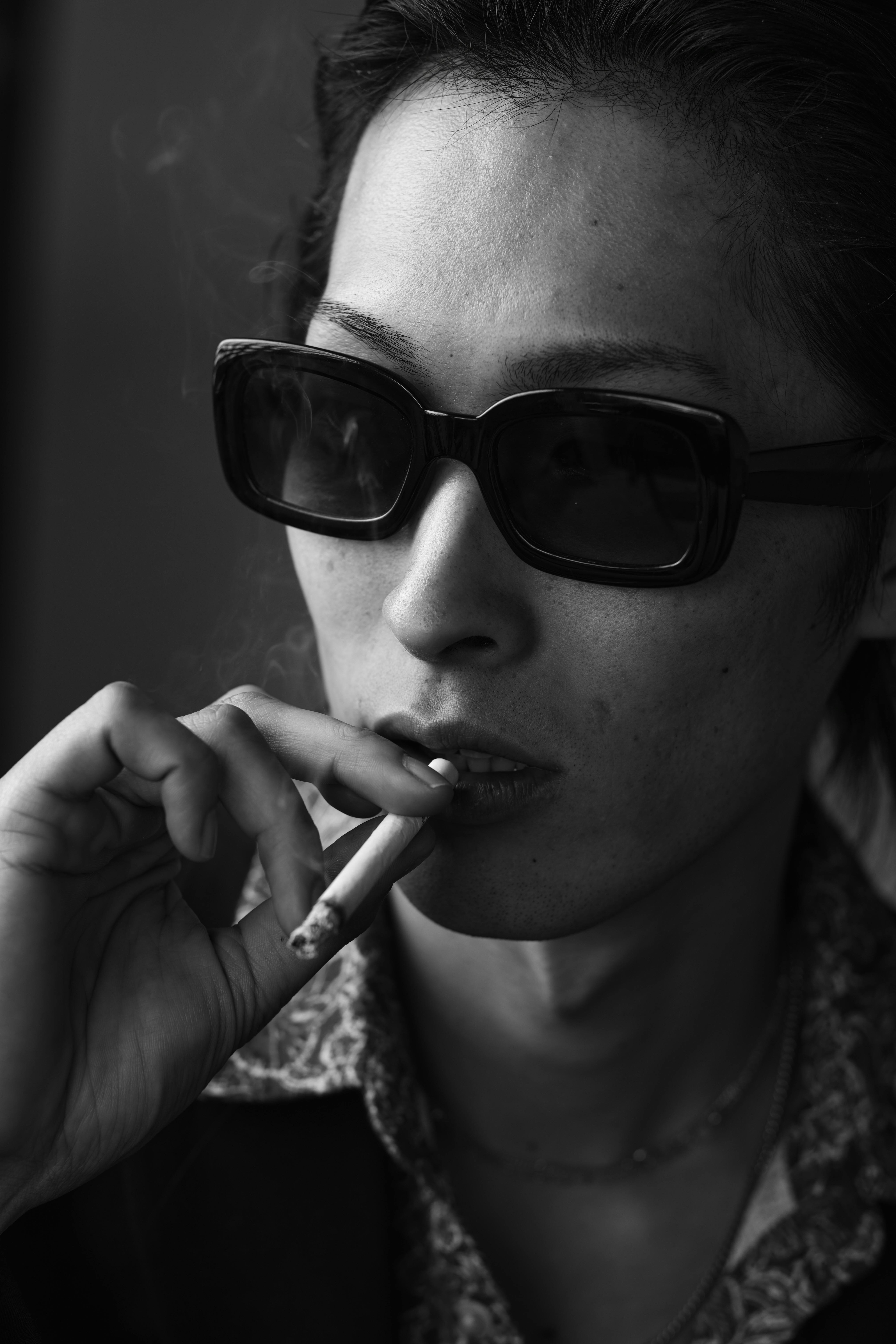 Black and White Portrait of a Smoking Person · Free Stock Photo