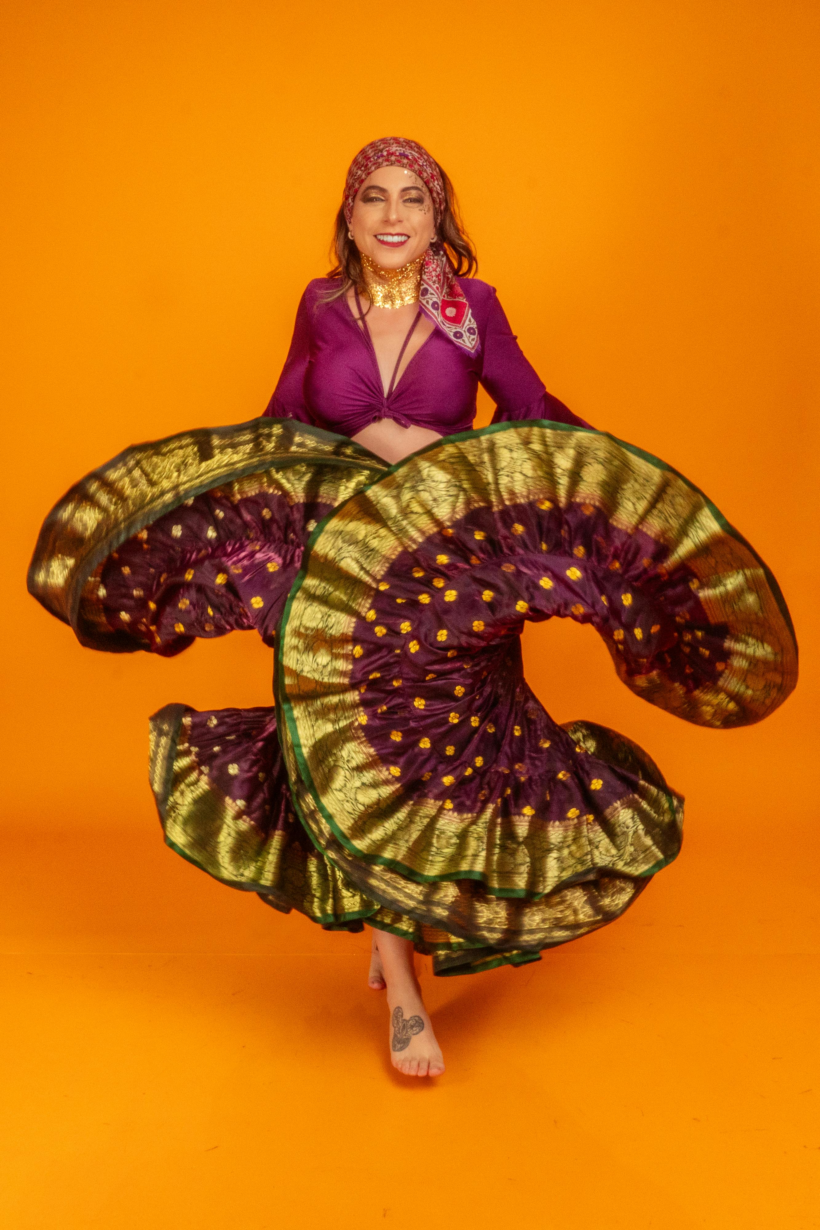 Vibrant Romani Dance Costume in Motion · Free Stock Photo