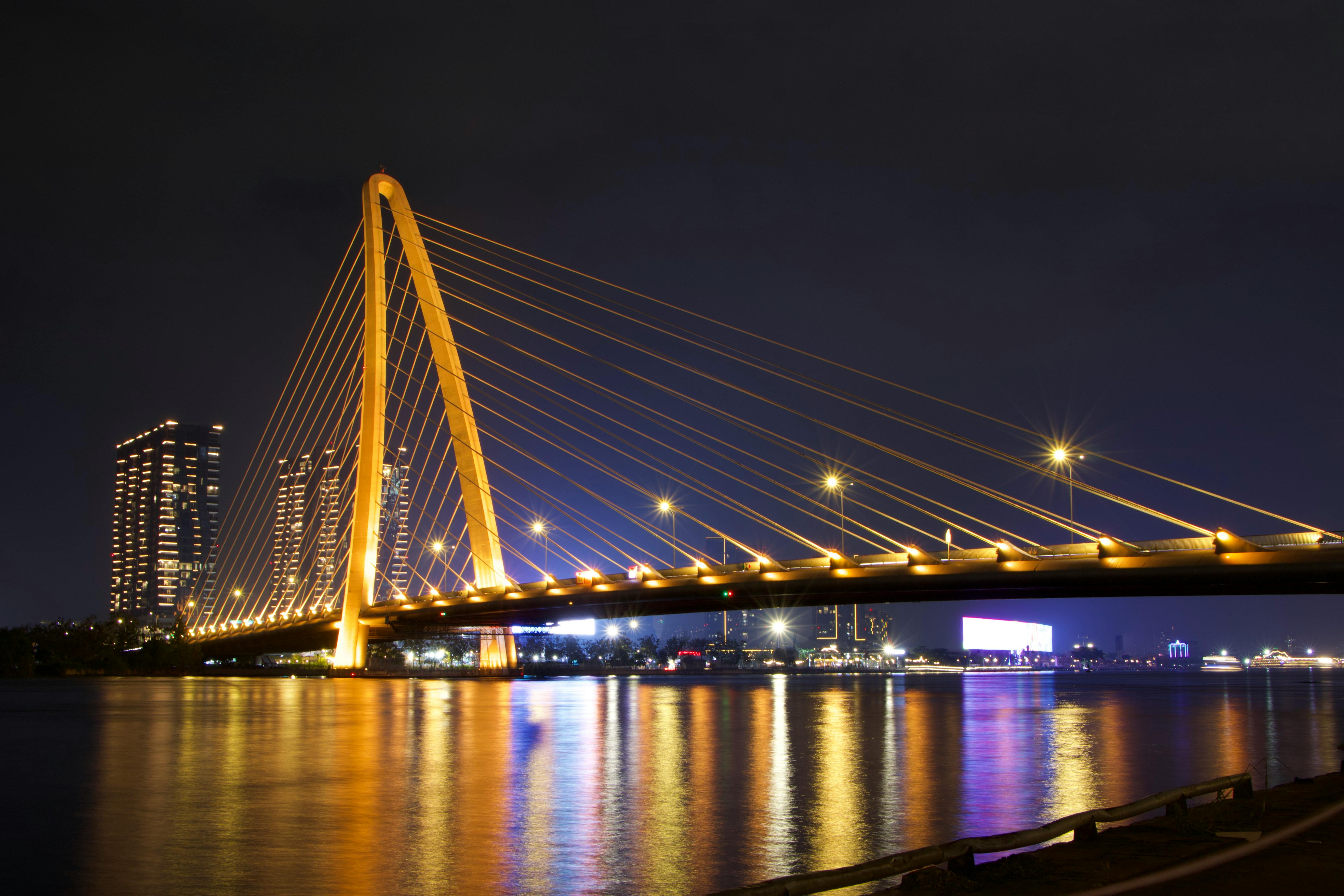 Illuminated Cable-Stayed Bridge at Night in Cityscape · Free Stock Photo